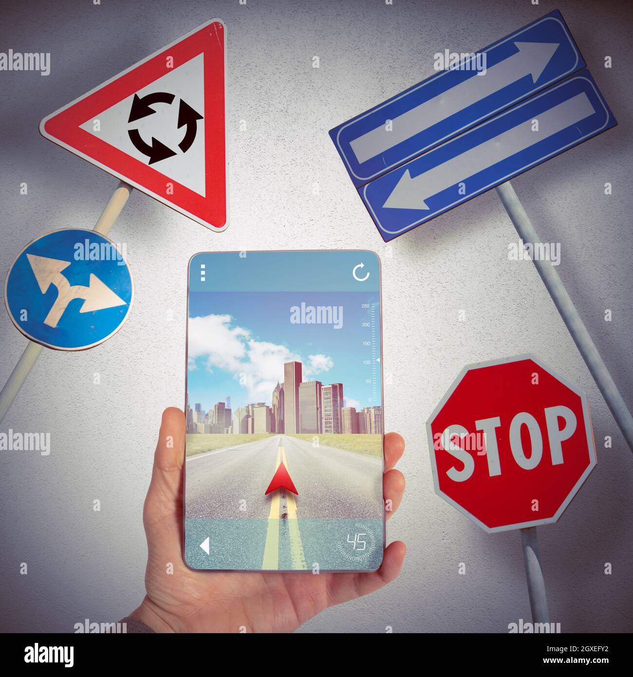 Drive with GPS Navigator and road signs Stock Photo - Alamy