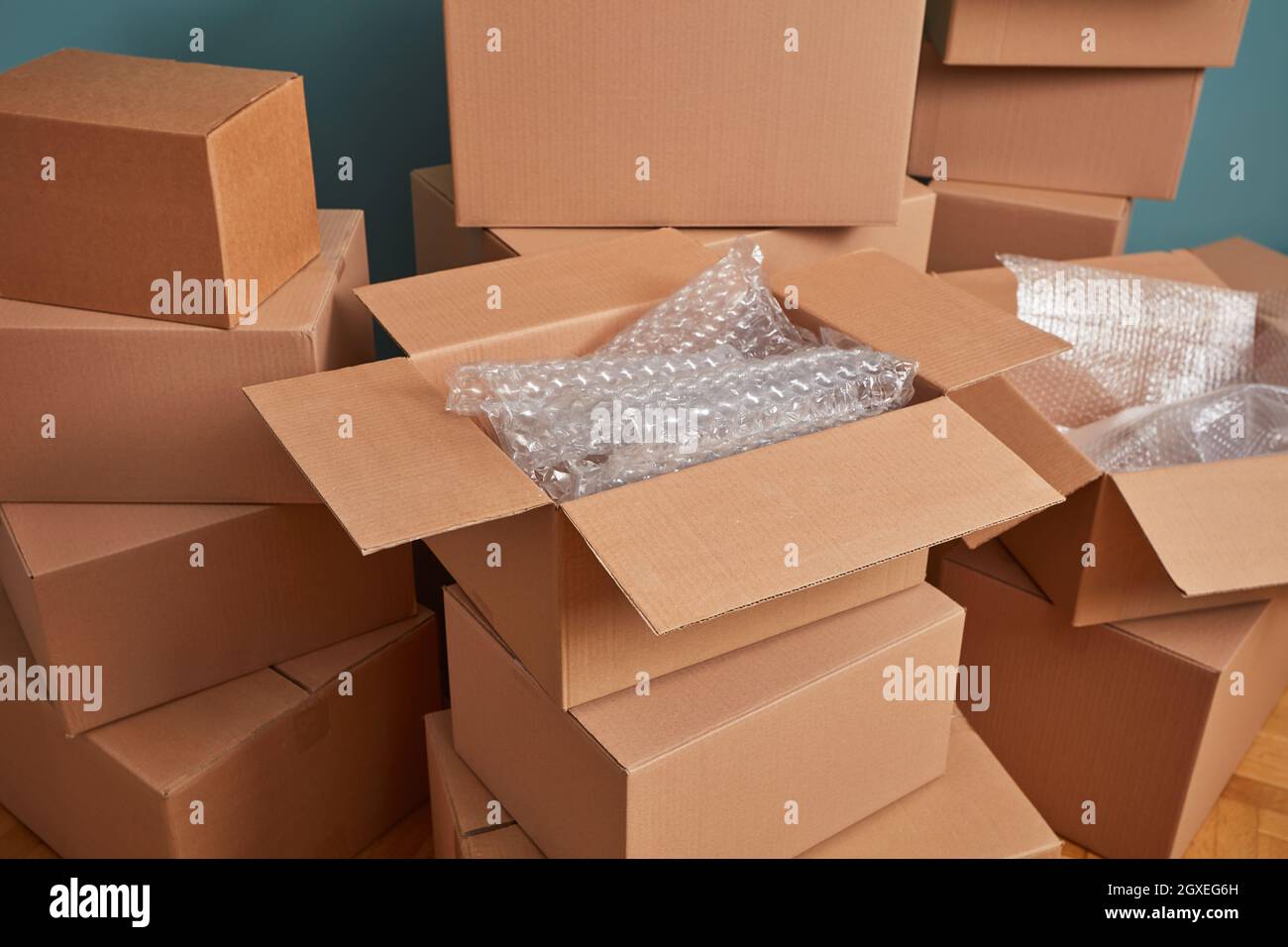 Cardboard boxes in room Stock Photo - Alamy