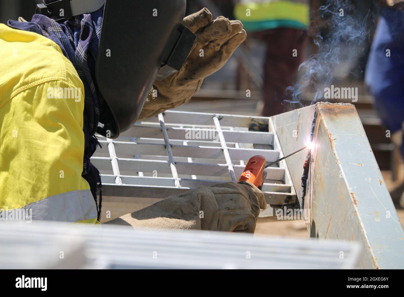 A male welder is at construction site welding Stock Photo - Alamy