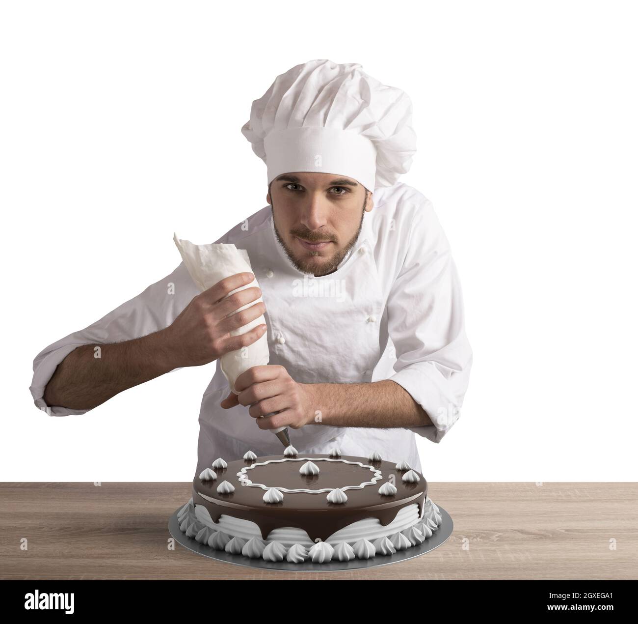 Confectioner prepares chocolate cream cake hi-res stock photography and ...