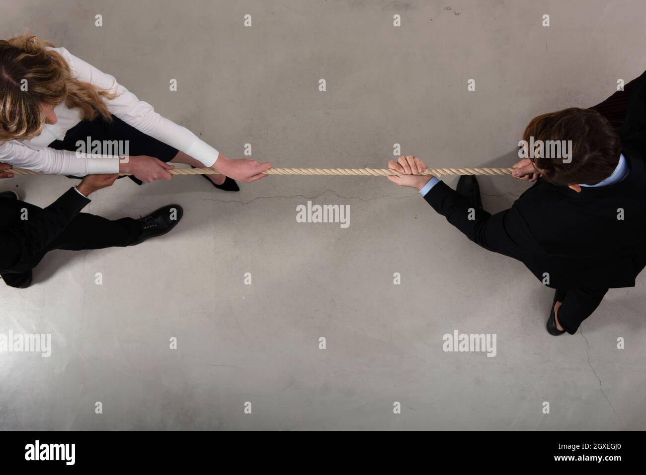 Rival business man and woman compete in office for the command by ...