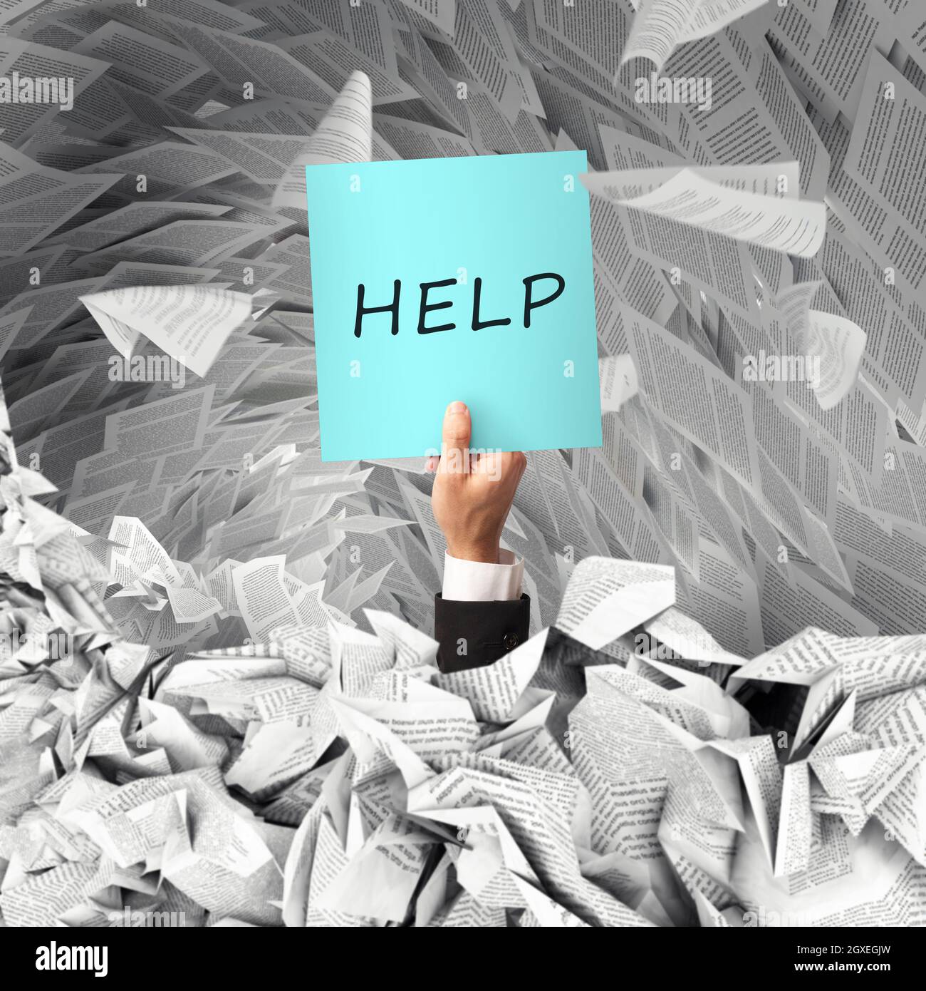 Man asks for help flooded with crumpled paper Stock Photo - Alamy