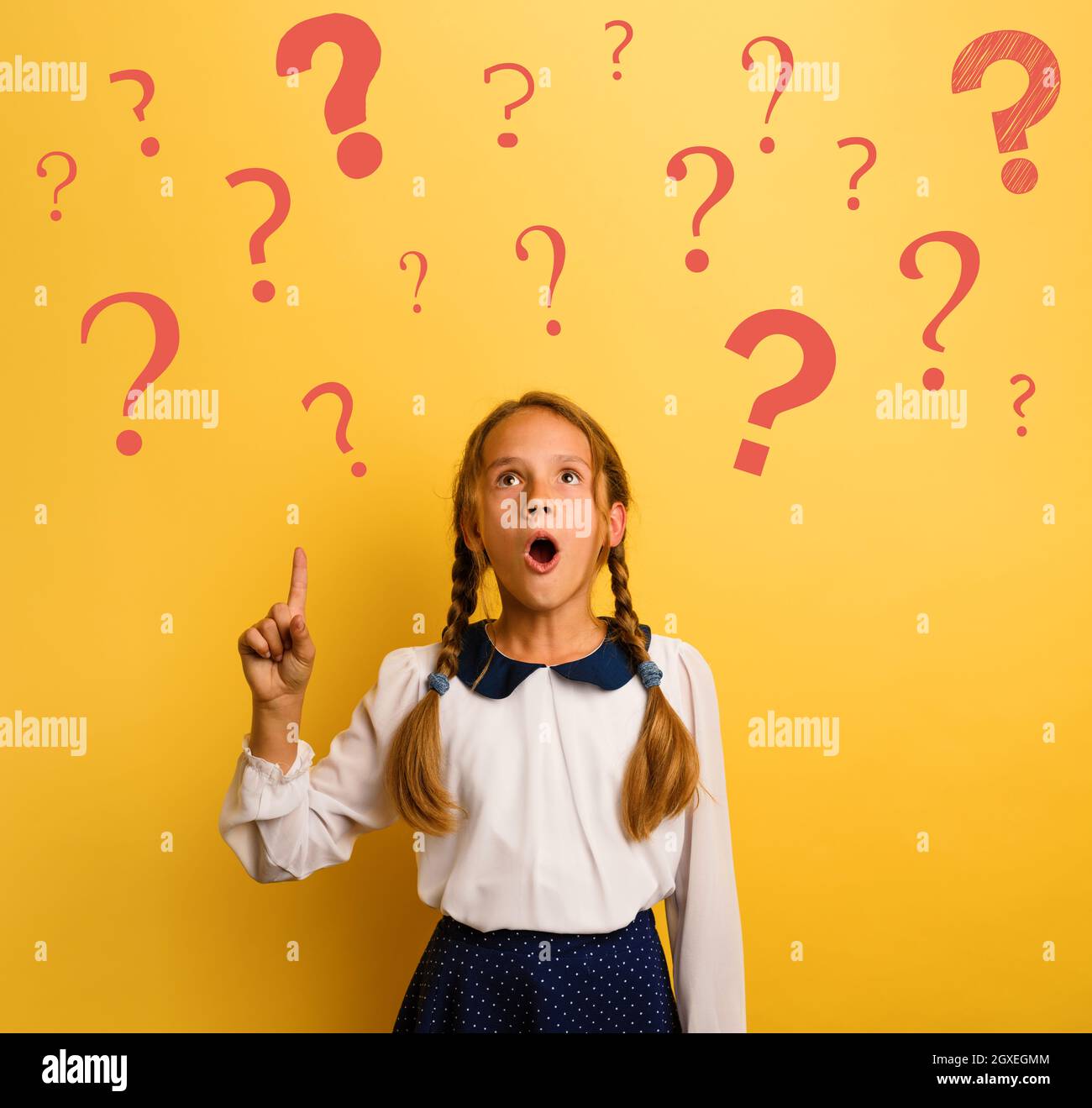 Young student is with shocked expression and indicates a lot of ...