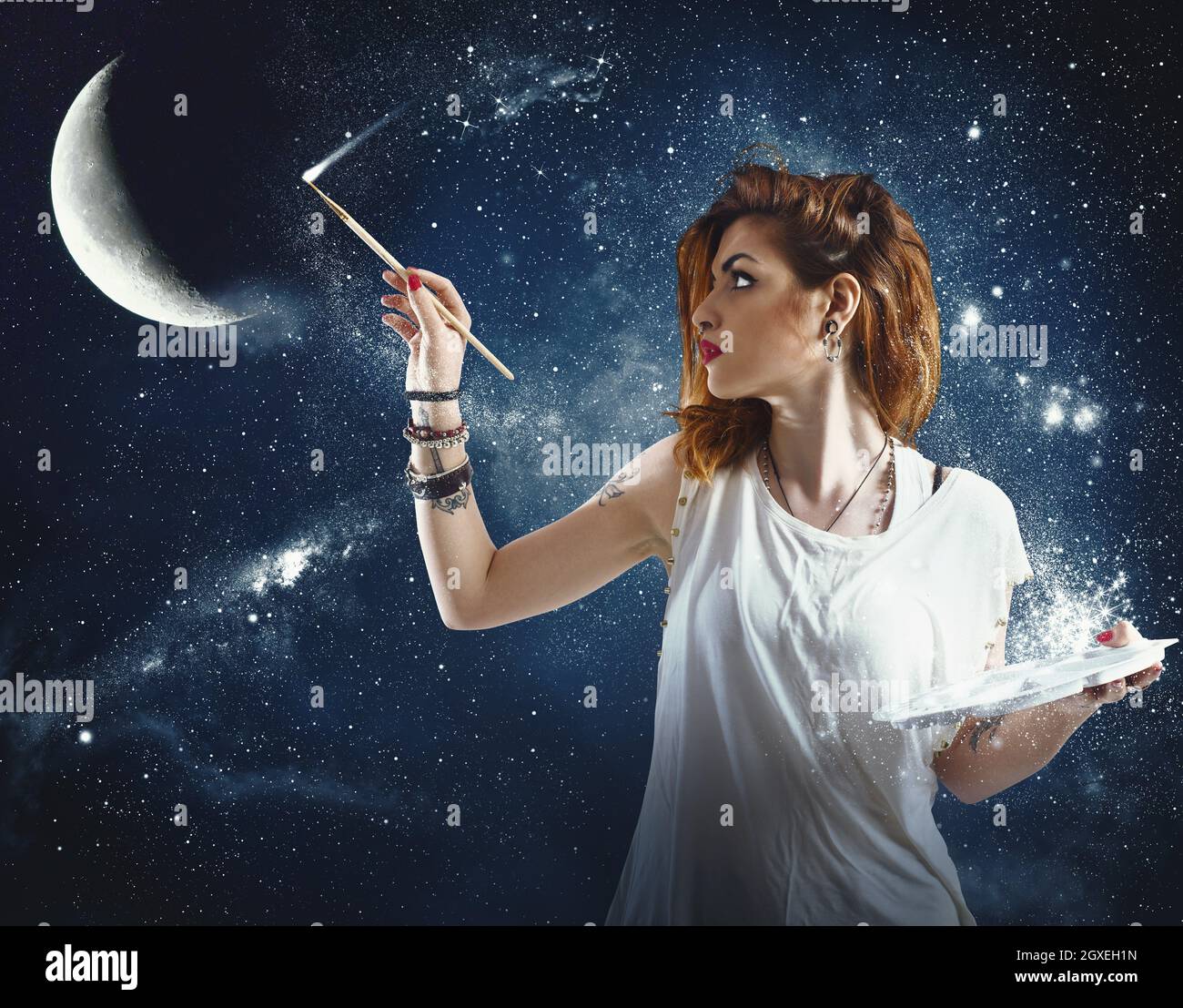 Girl paints the moon and the stars Stock Photo - Alamy