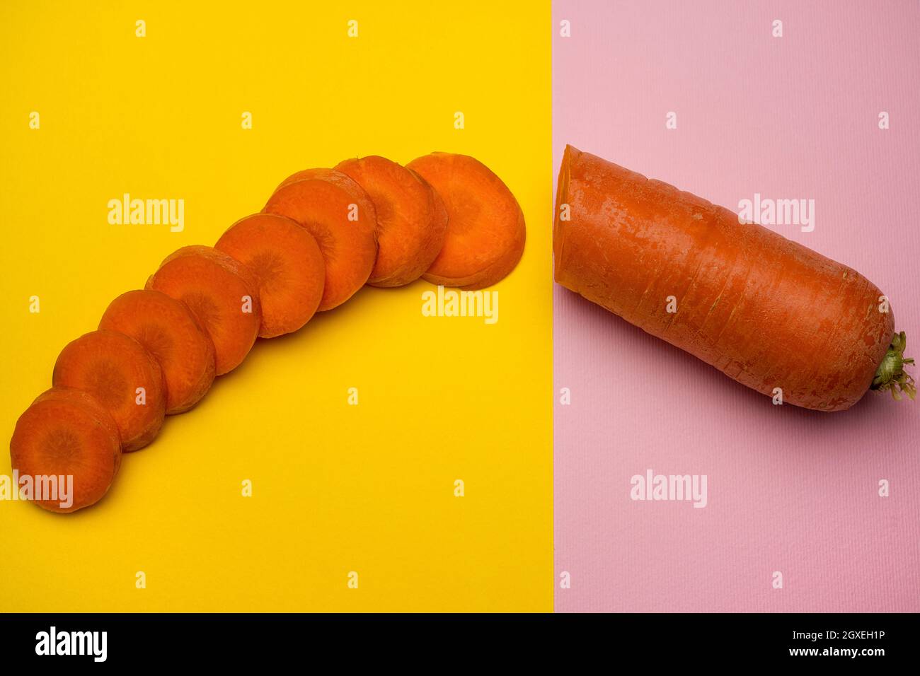 Carrot halves cut into slices on a colored surface Stock Photo - Alamy