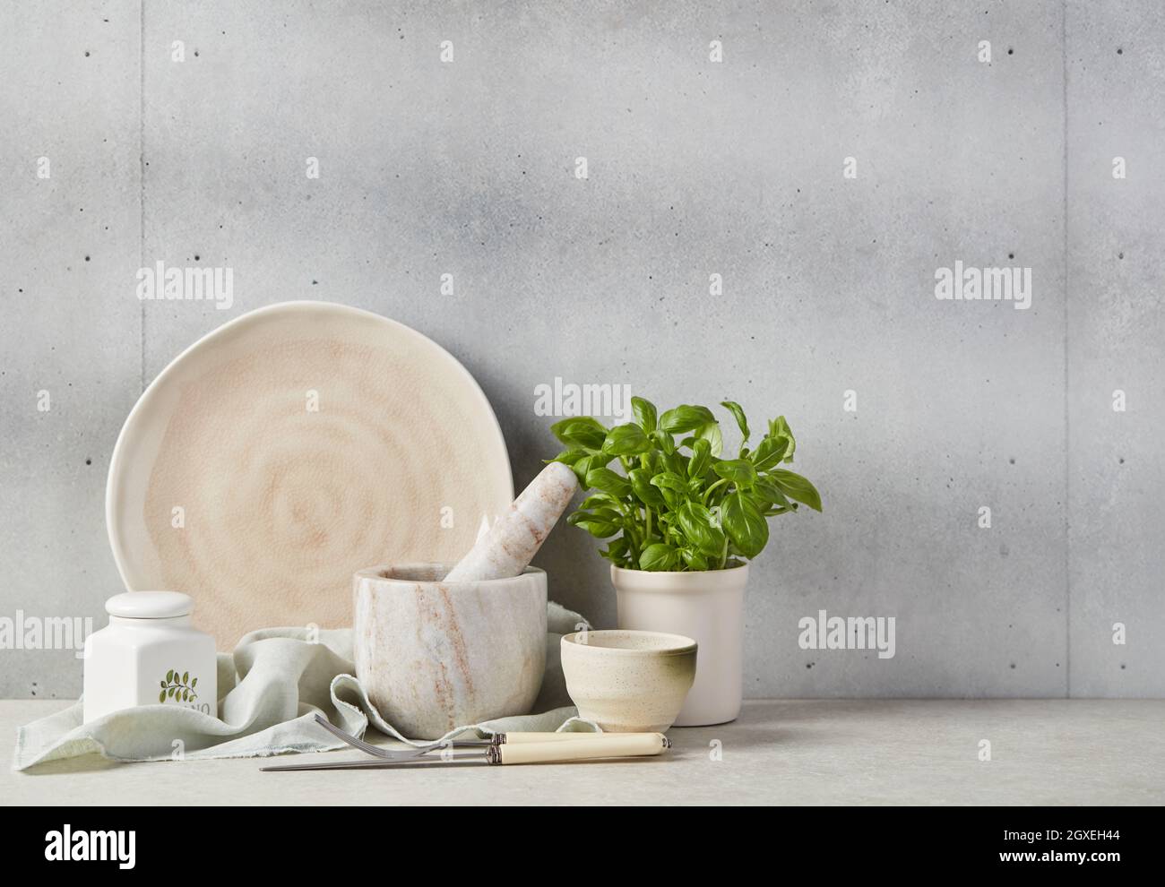 Kitchen utensils on concrete countertop Stock Photo - Alamy