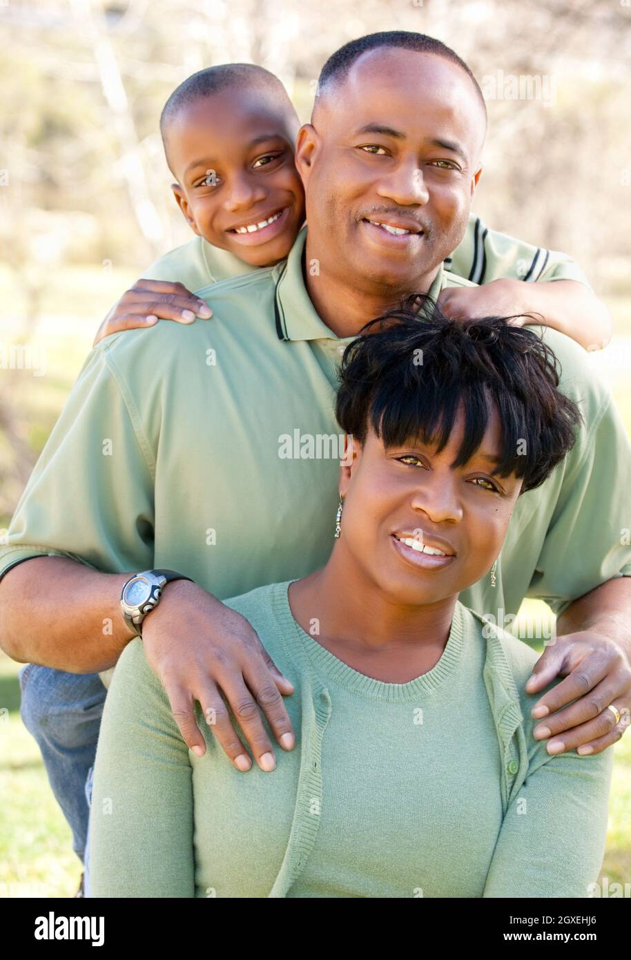 Attractive African American Man, Woman and Child posing in the park ...