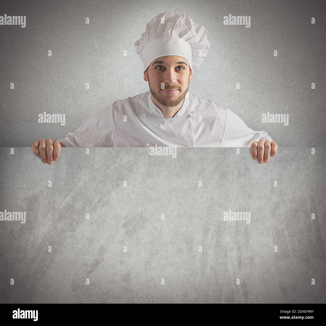 Chef showing his menu on a billboard Stock Photo - Alamy