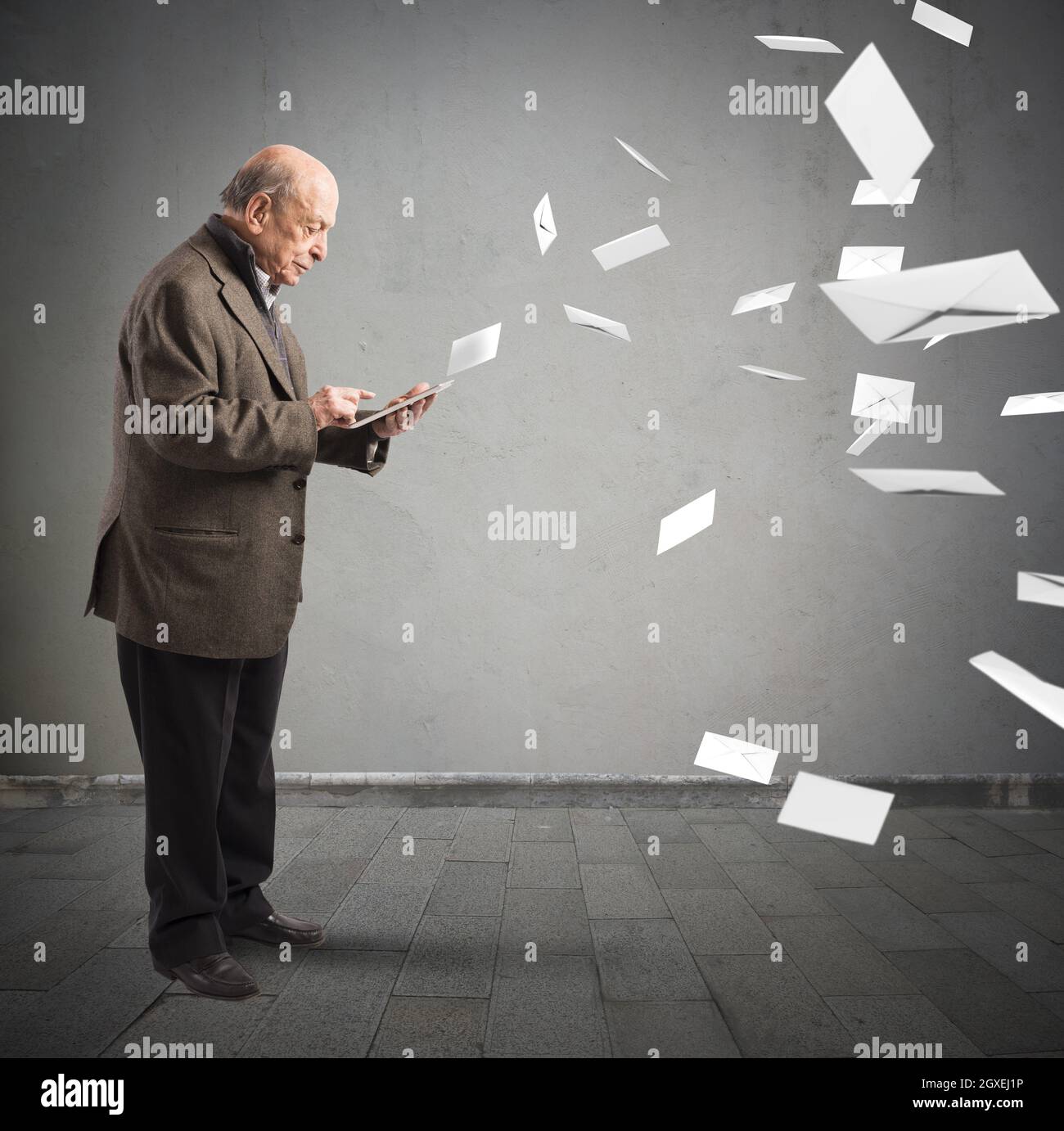 Old man send email from his tablet Stock Photo - Alamy