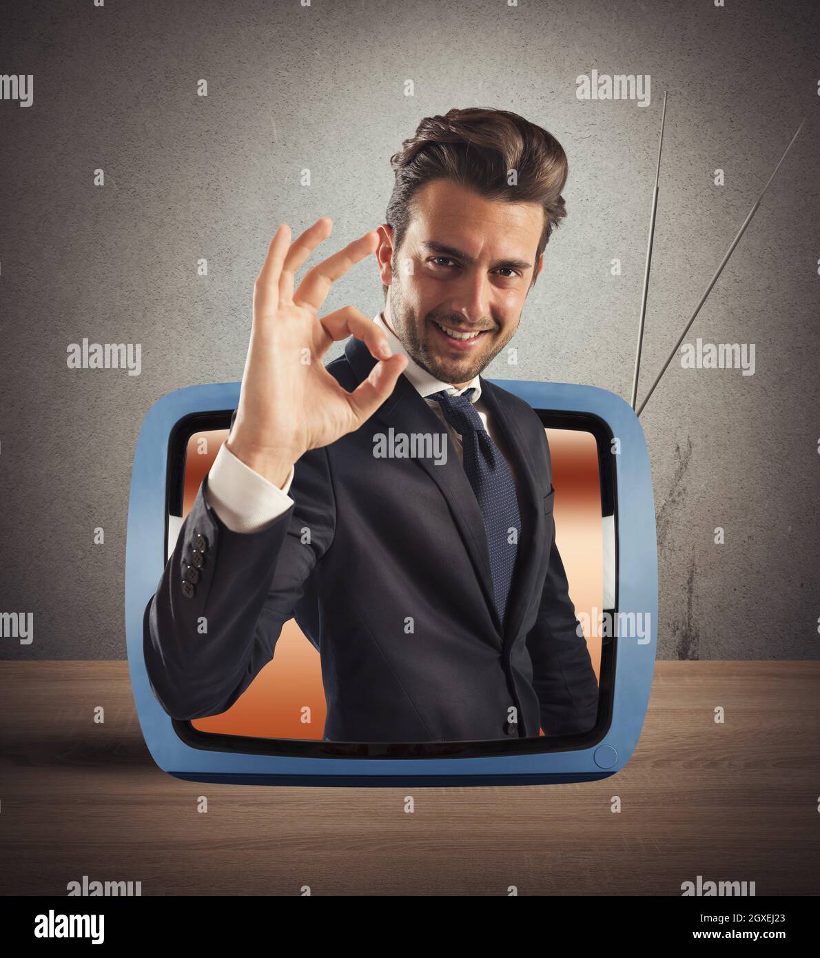 Smiling man comes out of vintage TV Stock Photo - Alamy