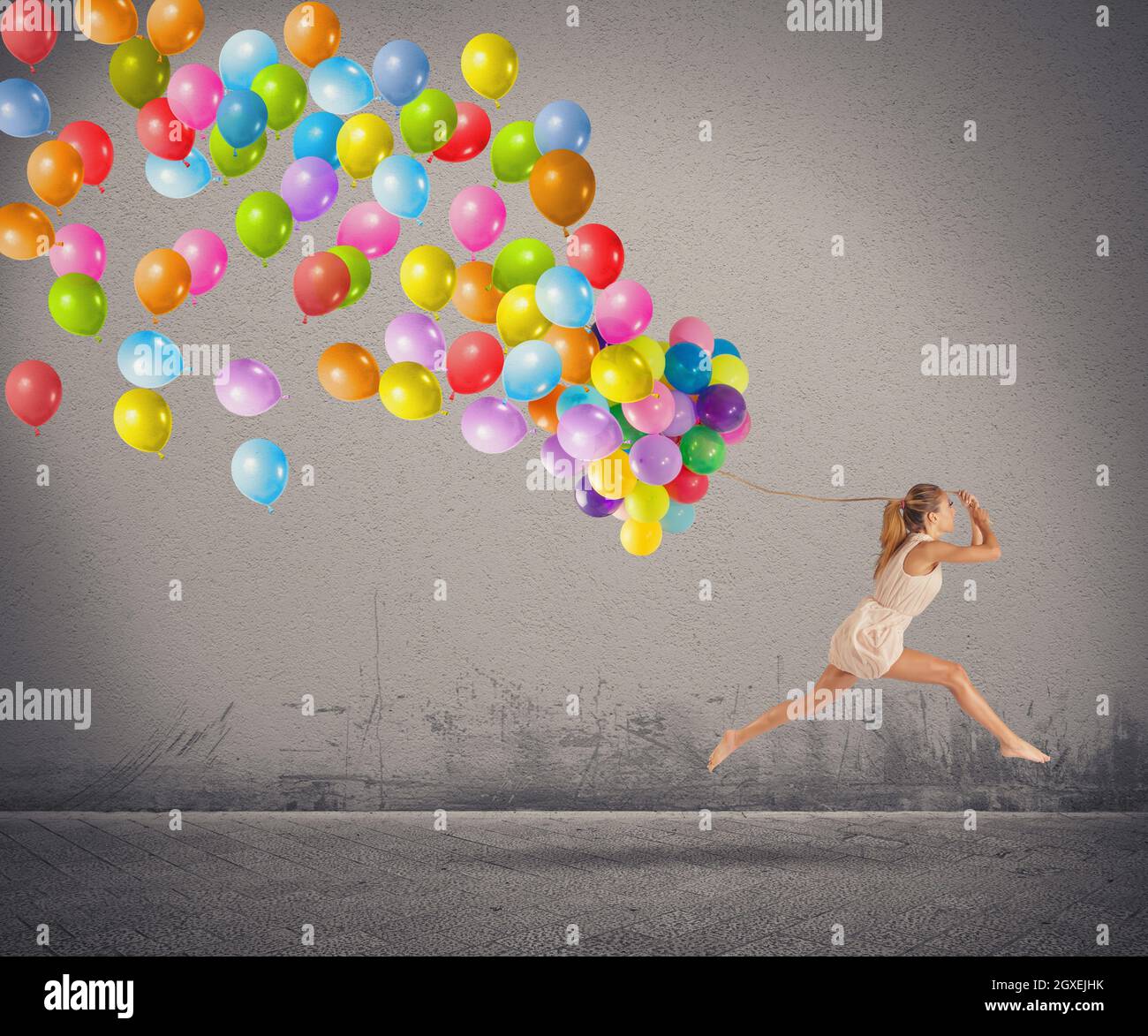Carefree and happy girl jumping with balloons Stock Photo - Alamy