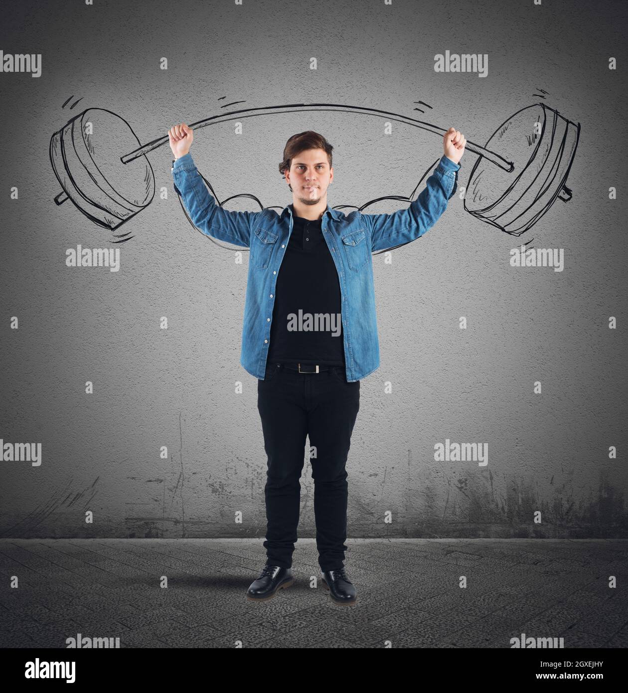 Surprisingly strong guy lifts weights with dumbbell Stock Photo - Alamy