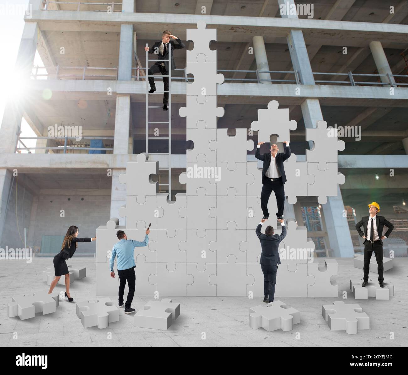 Teamwork cooperates for the construction of building Stock Photo - Alamy