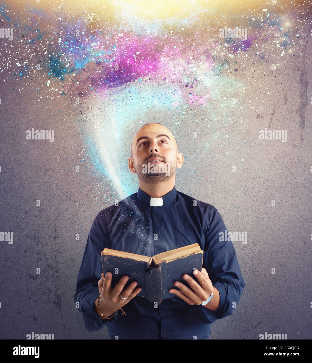 Priest observes universe light and god power Stock Photo - Alamy
