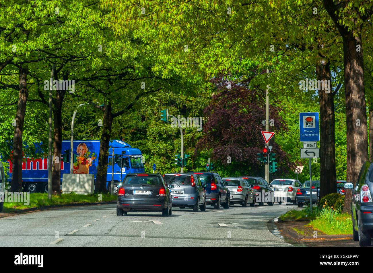 Cars stop in the line on crossroads for red traffic light Stock Photo ...
