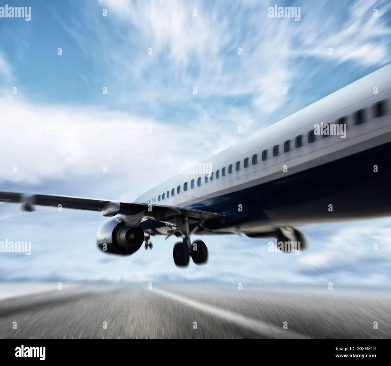 Aircraft taking off on a runway with sunlight Stock Photo - Alamy