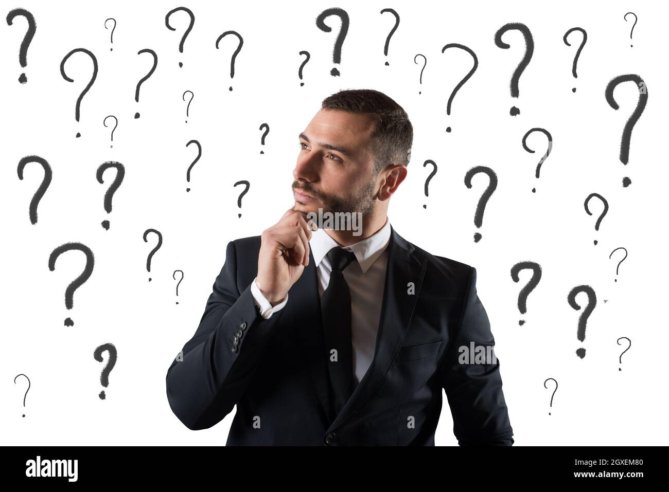 Confused and pensive businessman worried about the future, surrounded ...