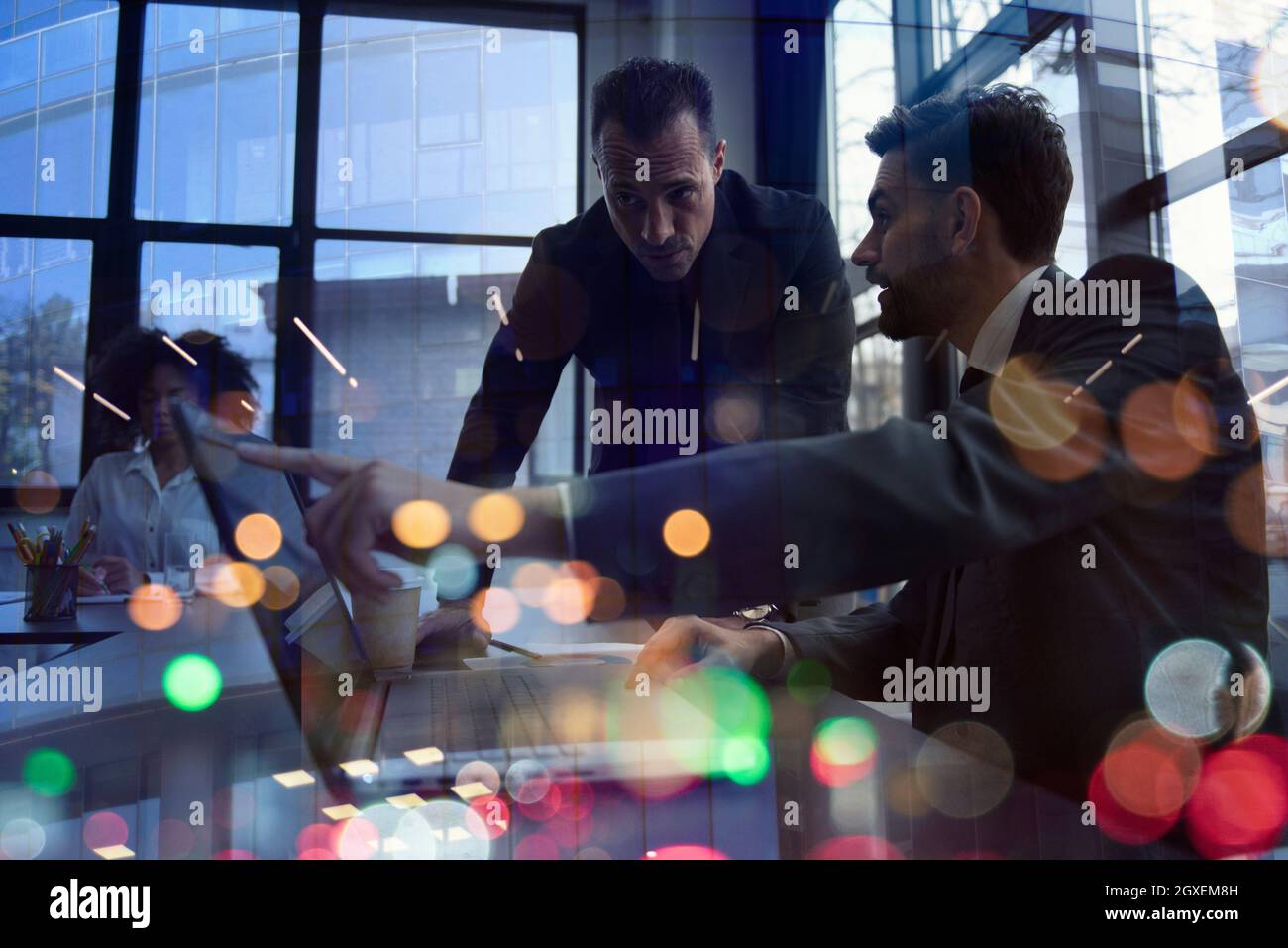 Business people work together in office with a laptop connected to the ...