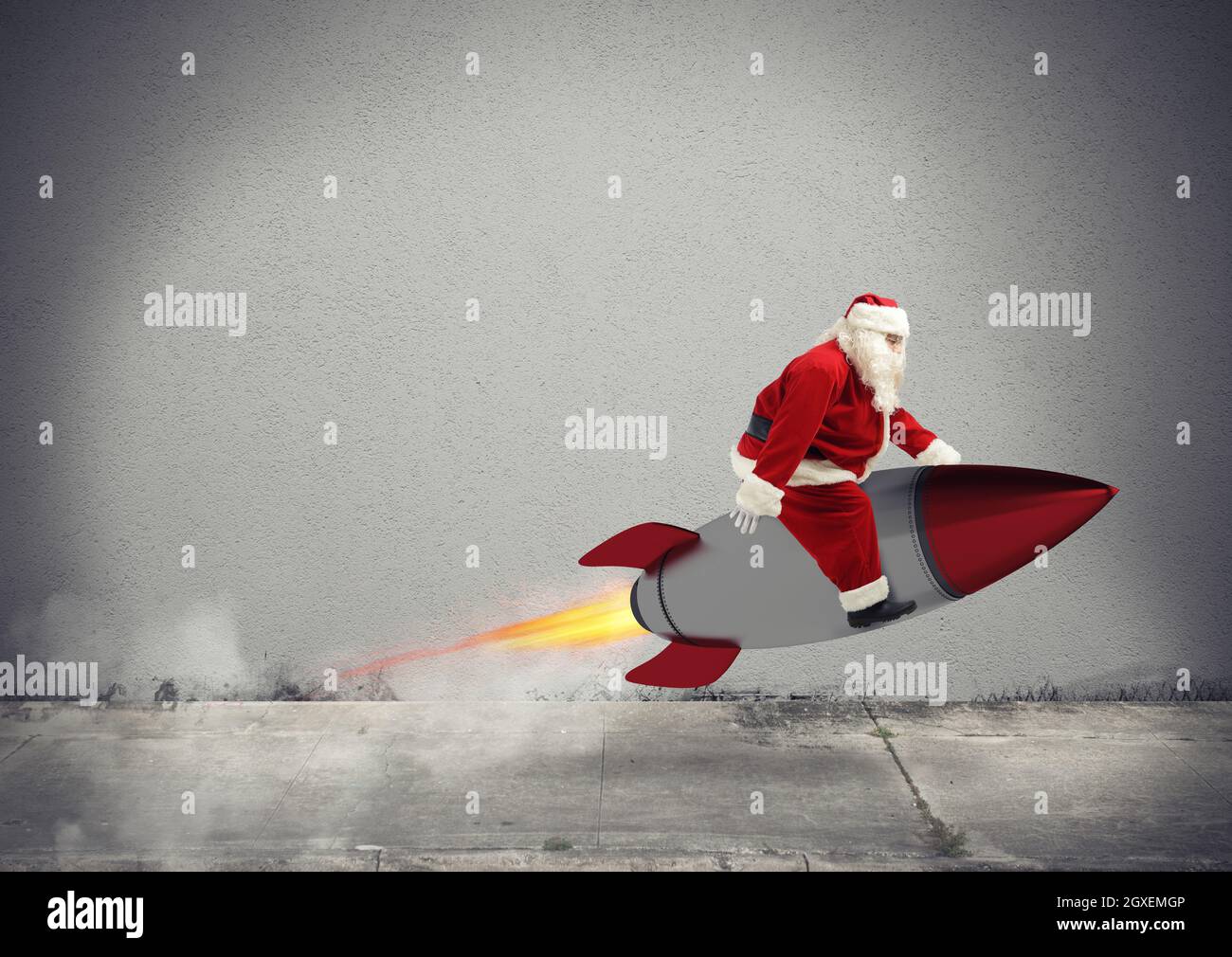 Santa Claus with gift box ready to fly with a rocket in the sky Stock ...