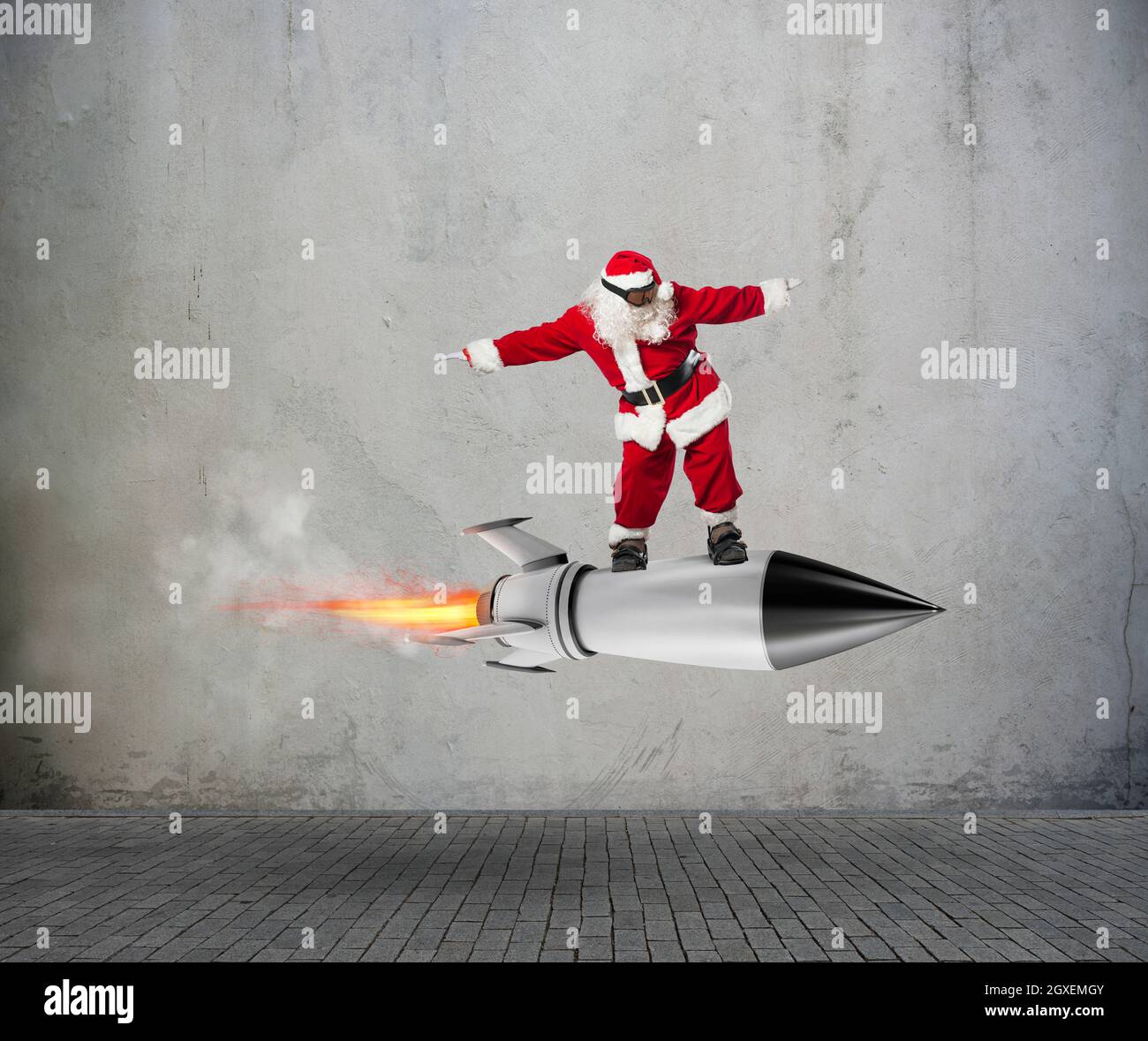 Santa Claus with gift box ready to fly with a rocket in the sky Stock ...