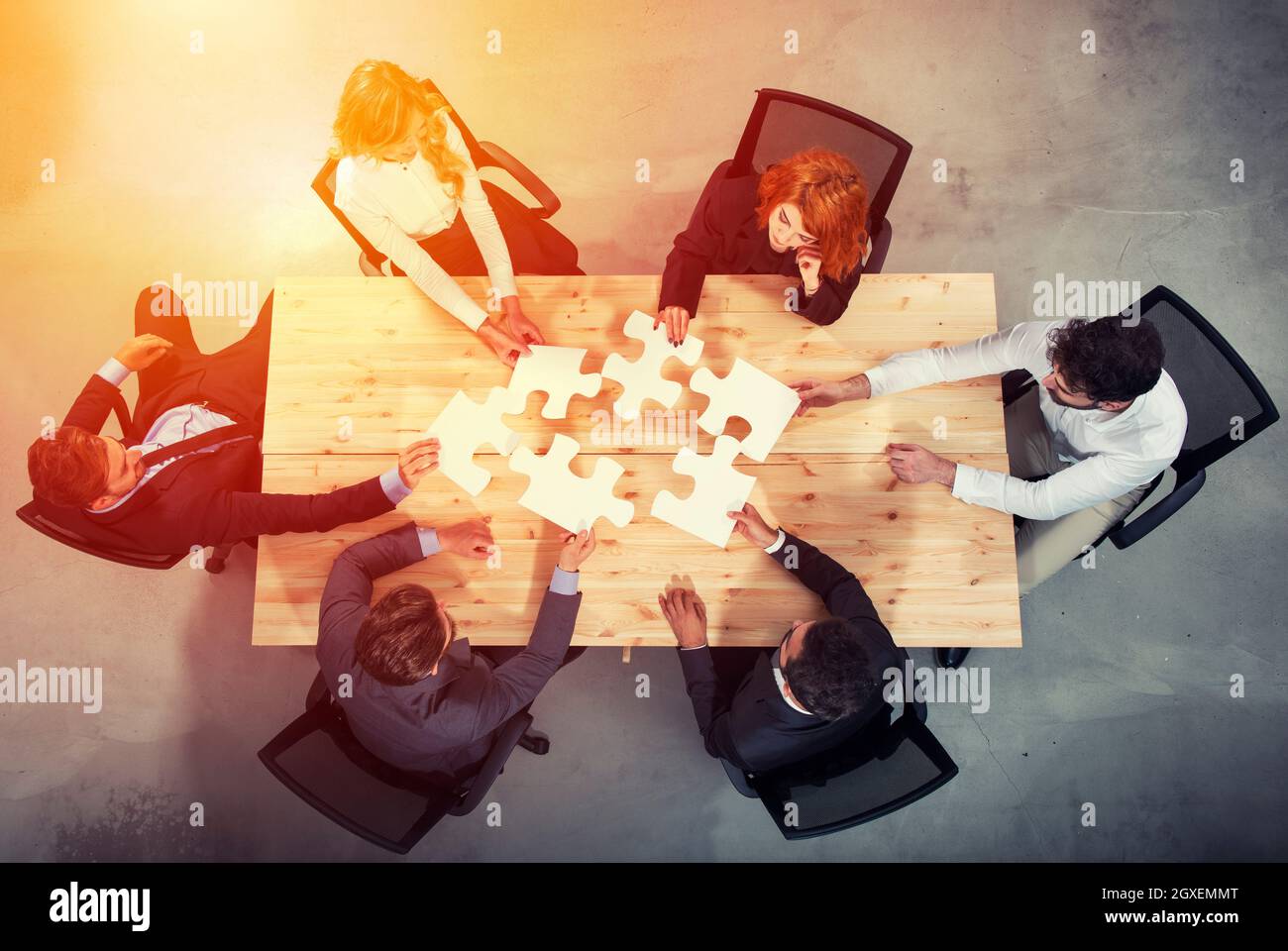 Businessmen working together to build a puzzle. Concept of teamwork, partnership, integration ...