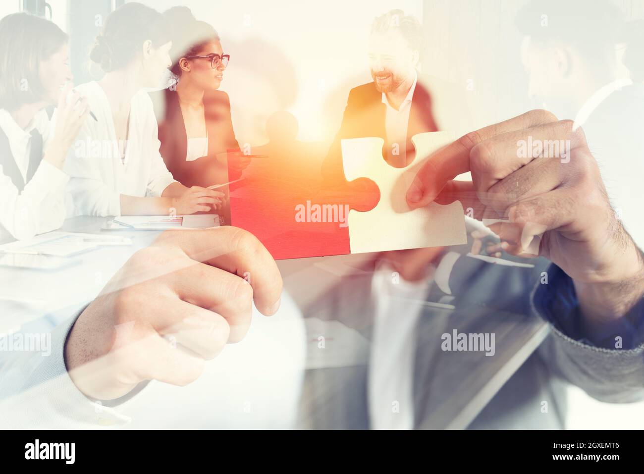 Businessmen working together to build a colored puzzle. Concept of teamwork, partnership ...