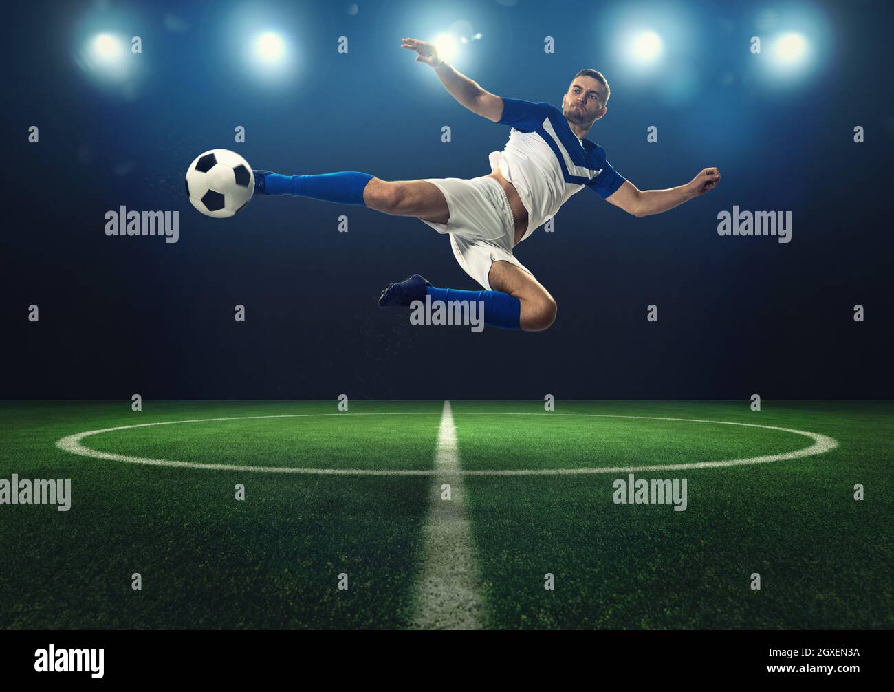 Soccer player kicks a ball goalie hi-res stock photography and images ...
