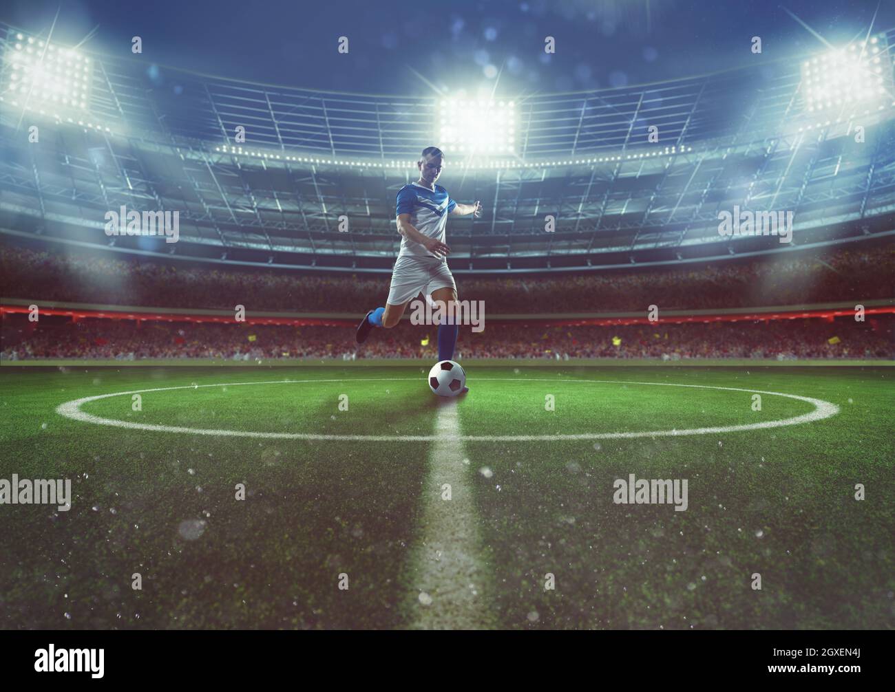 Football action scene with player at the stadium Stock Photo - Alamy