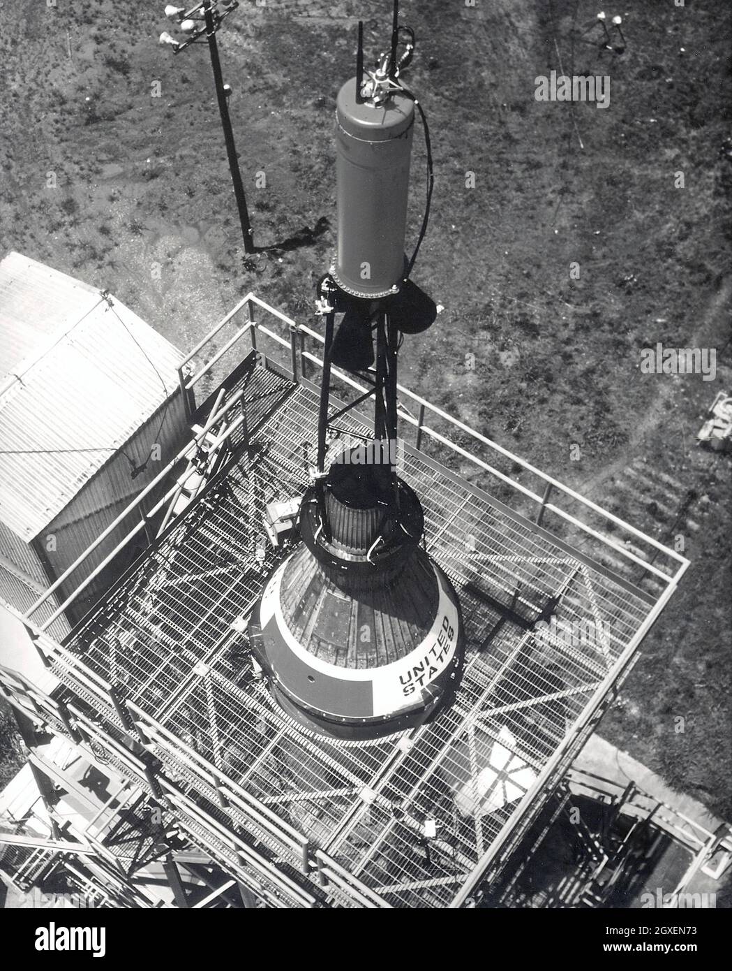 THIS PHOTOGRAPH DEPICTS INSTALLATION OF THE MERCURY CAPSULE AND ESCAPE ...