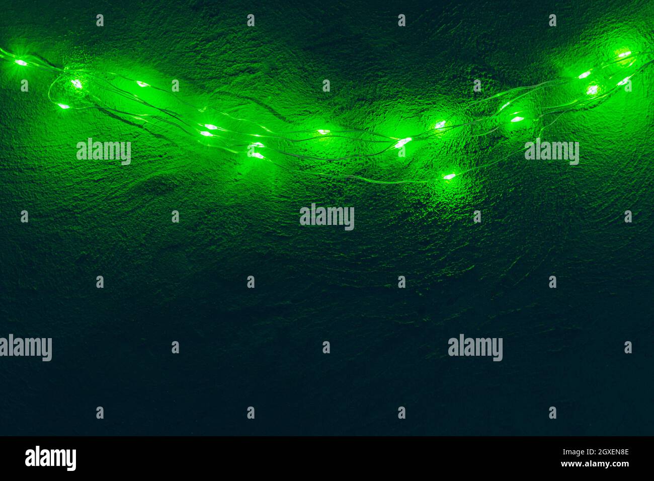Garland with green light elements in the dark close up Stock Photo - Alamy