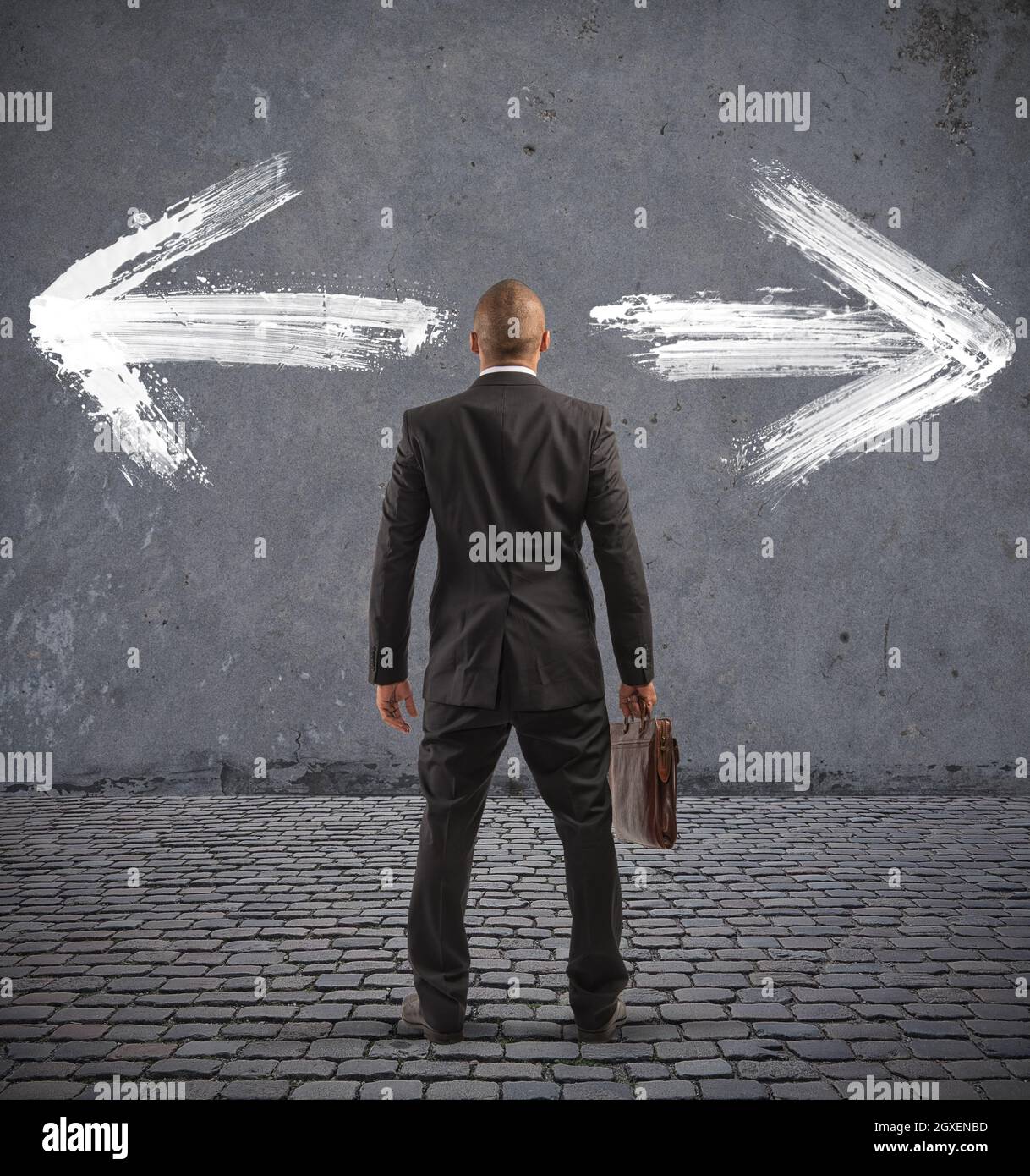Businessman in front of a choice with arrows in opposite directions ...