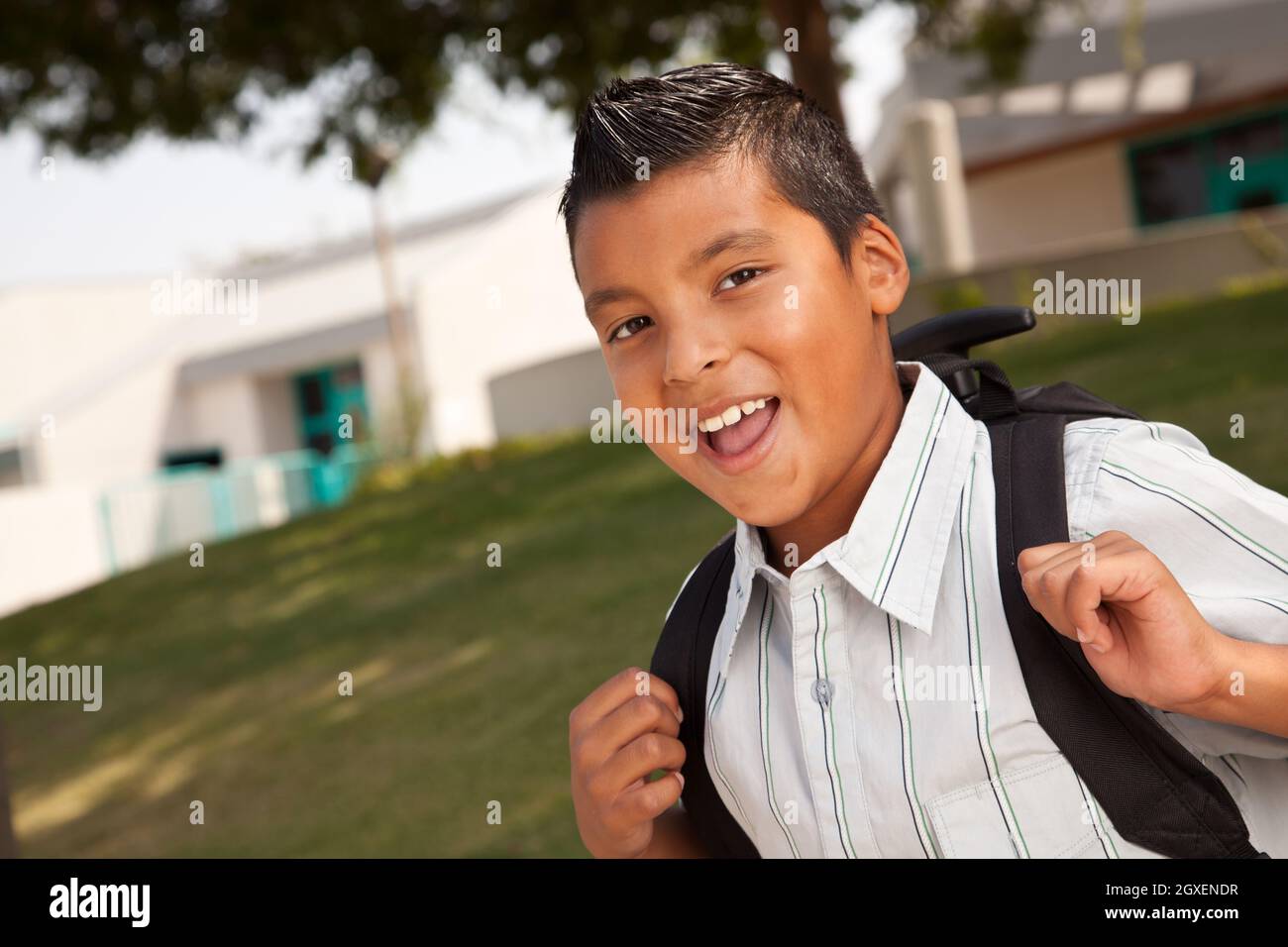 Happy Young Hispanic Boy with Backpack Ready for School Stock Photo - Alamy