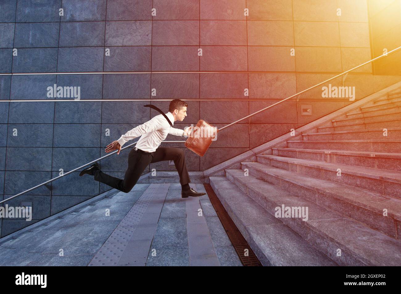 Businessman runs fast to office over a modern staircase Stock Photo - Alamy