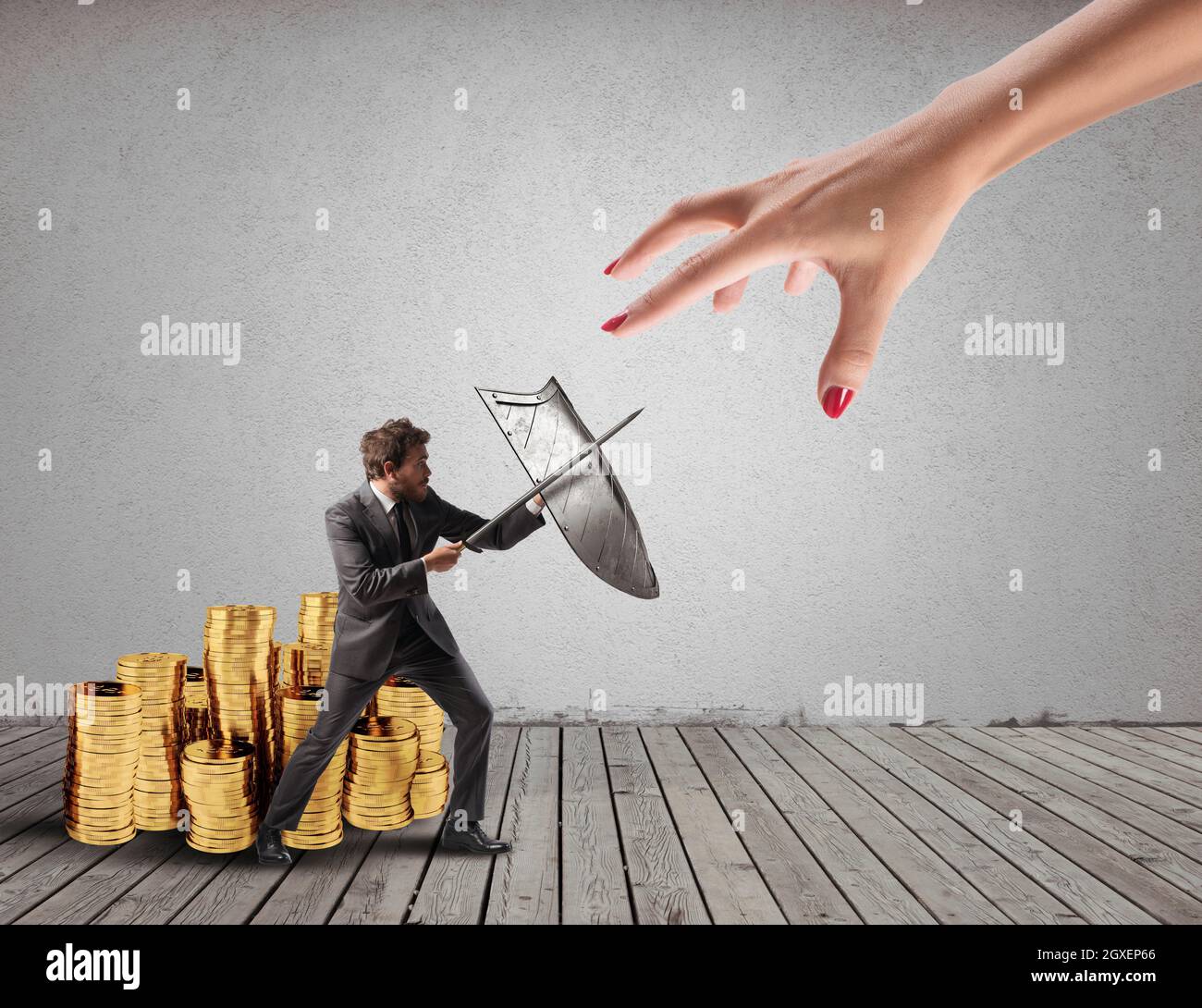 Business man protects a pile of coins fighting against a hand trying to ...