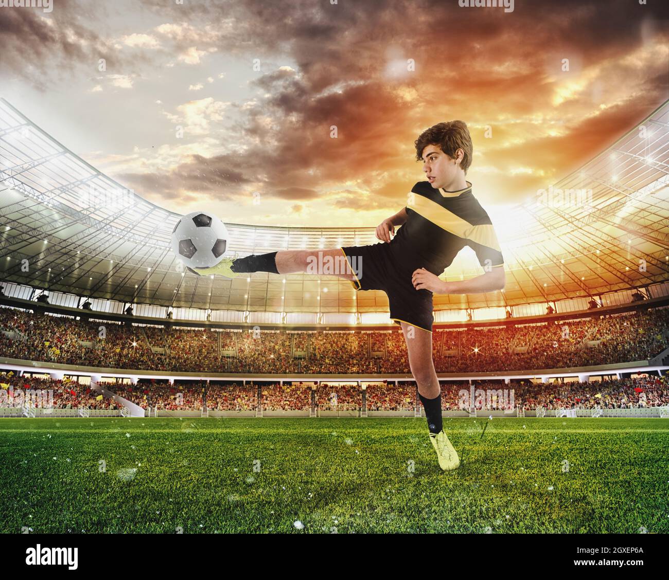 Football action scene with competing young football players at the ...