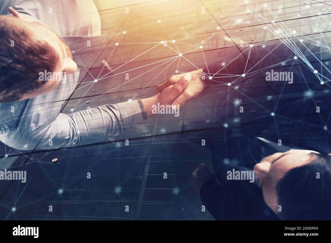 Handshaking business person in the office with network effect. concept ...