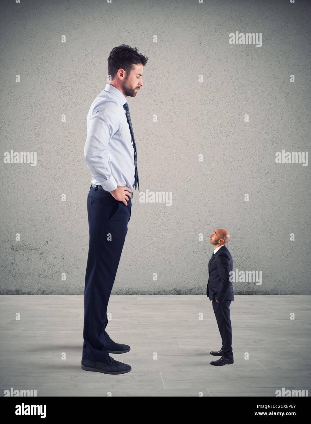 Small businessman terrified by his big boss in office Stock Photo - Alamy