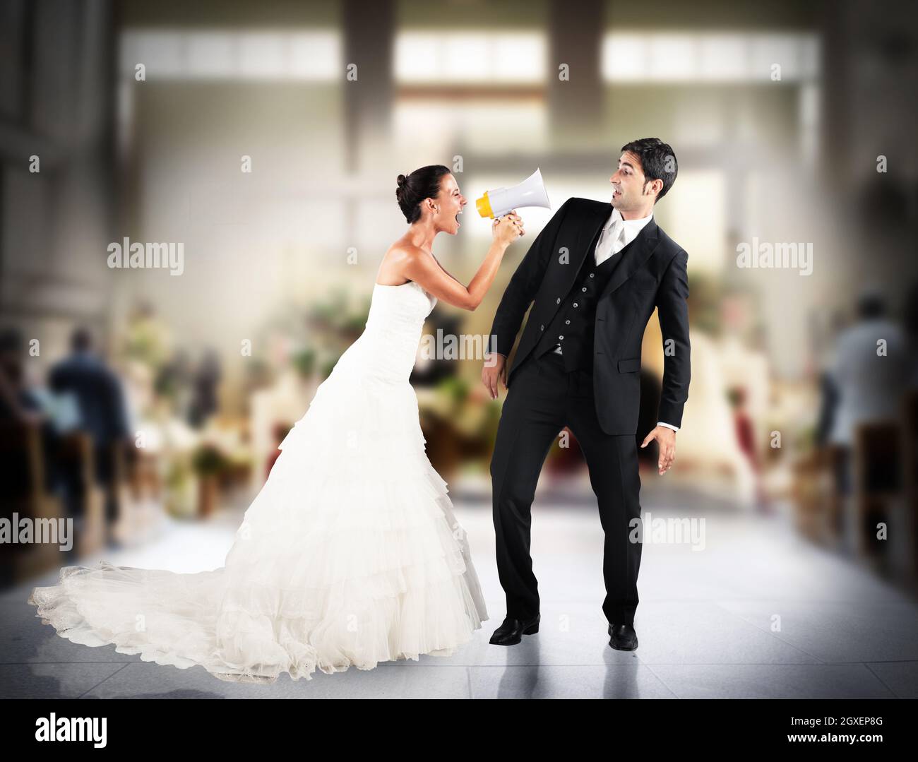 Angry wife screaming with megaphone to husband Stock Photo - Alamy