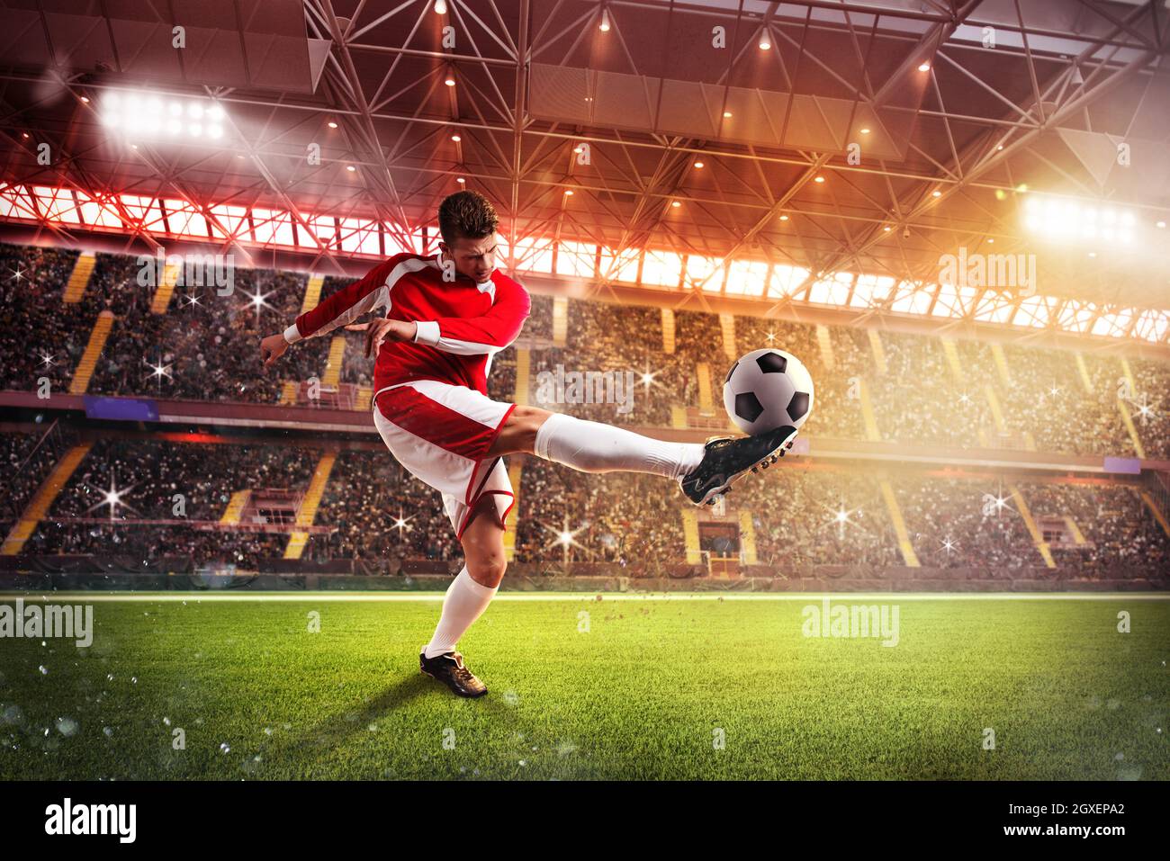 Football player play in a stadium with audience Stock Photo - Alamy