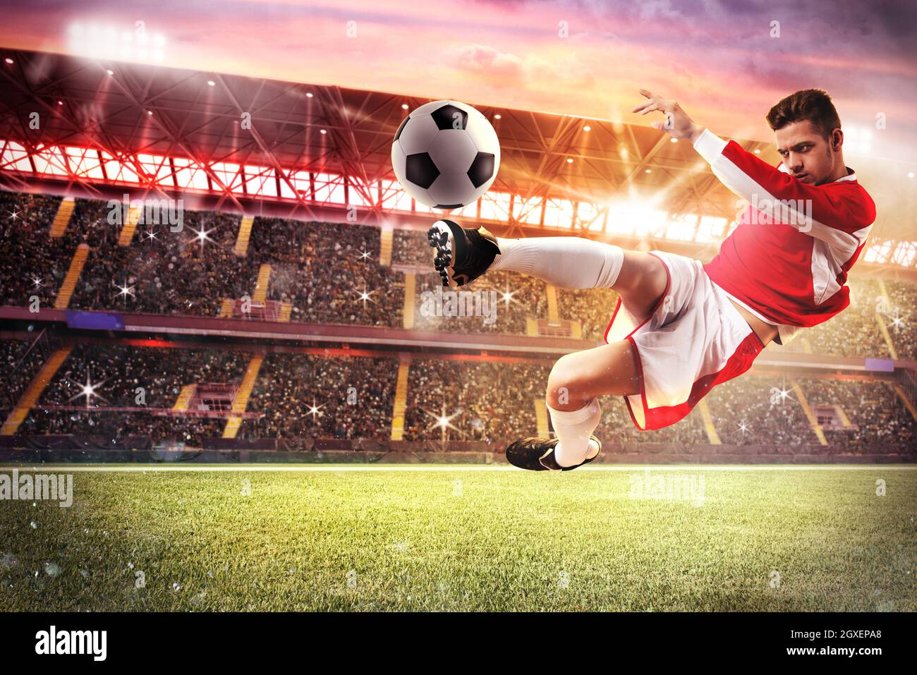 Football player play in a stadium with audience Stock Photo - Alamy