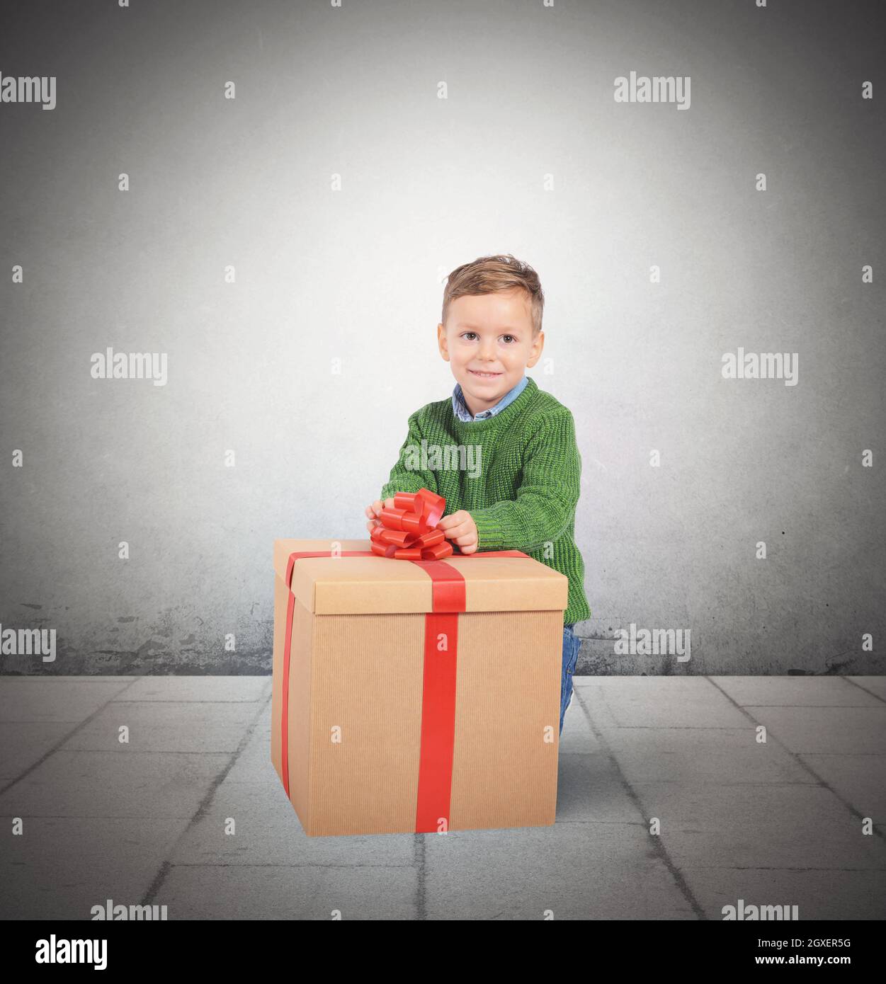 Child happy to have received a gift Stock Photo - Alamy