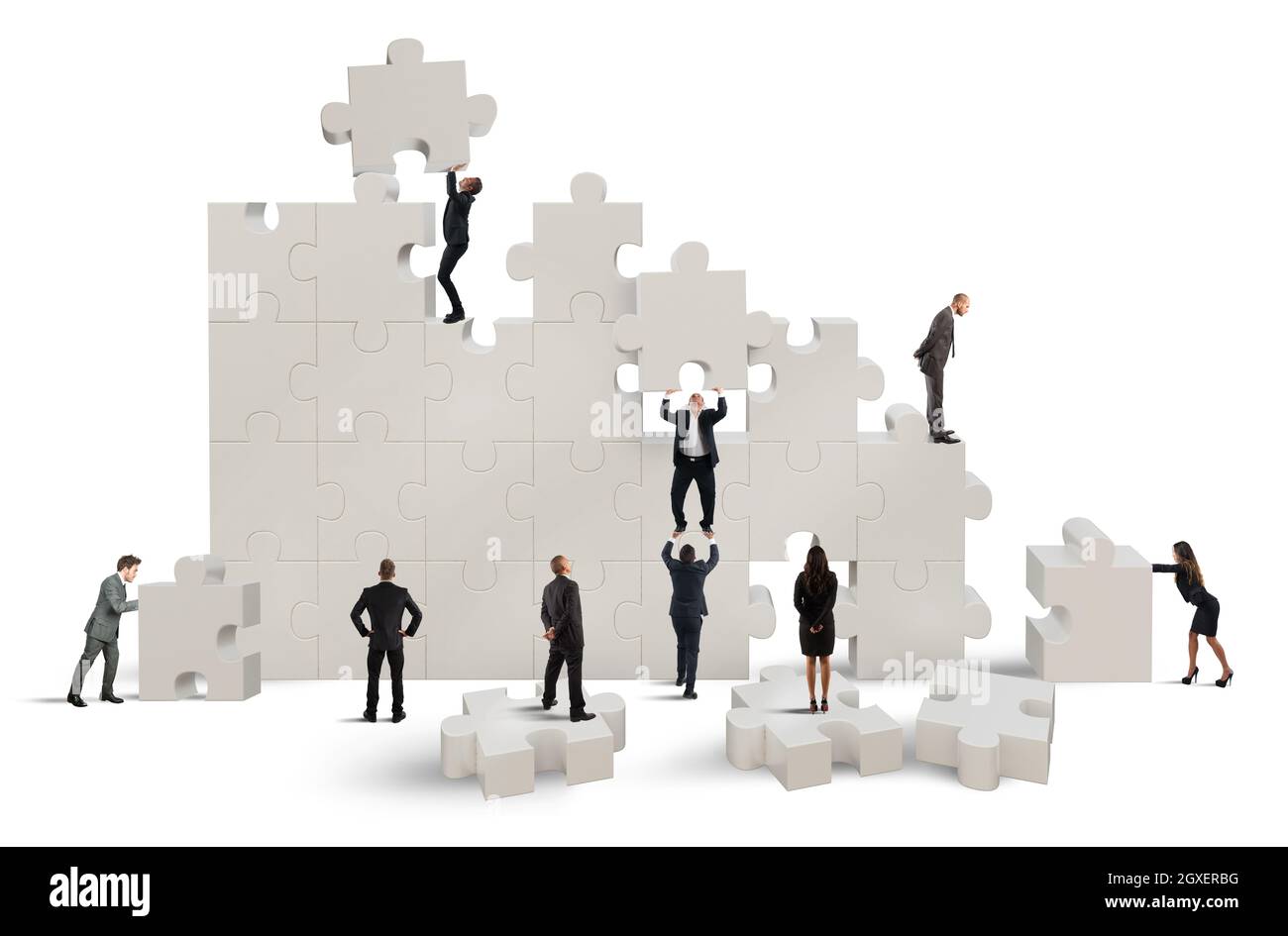Business team working to build a puzzle Stock Photo - Alamy