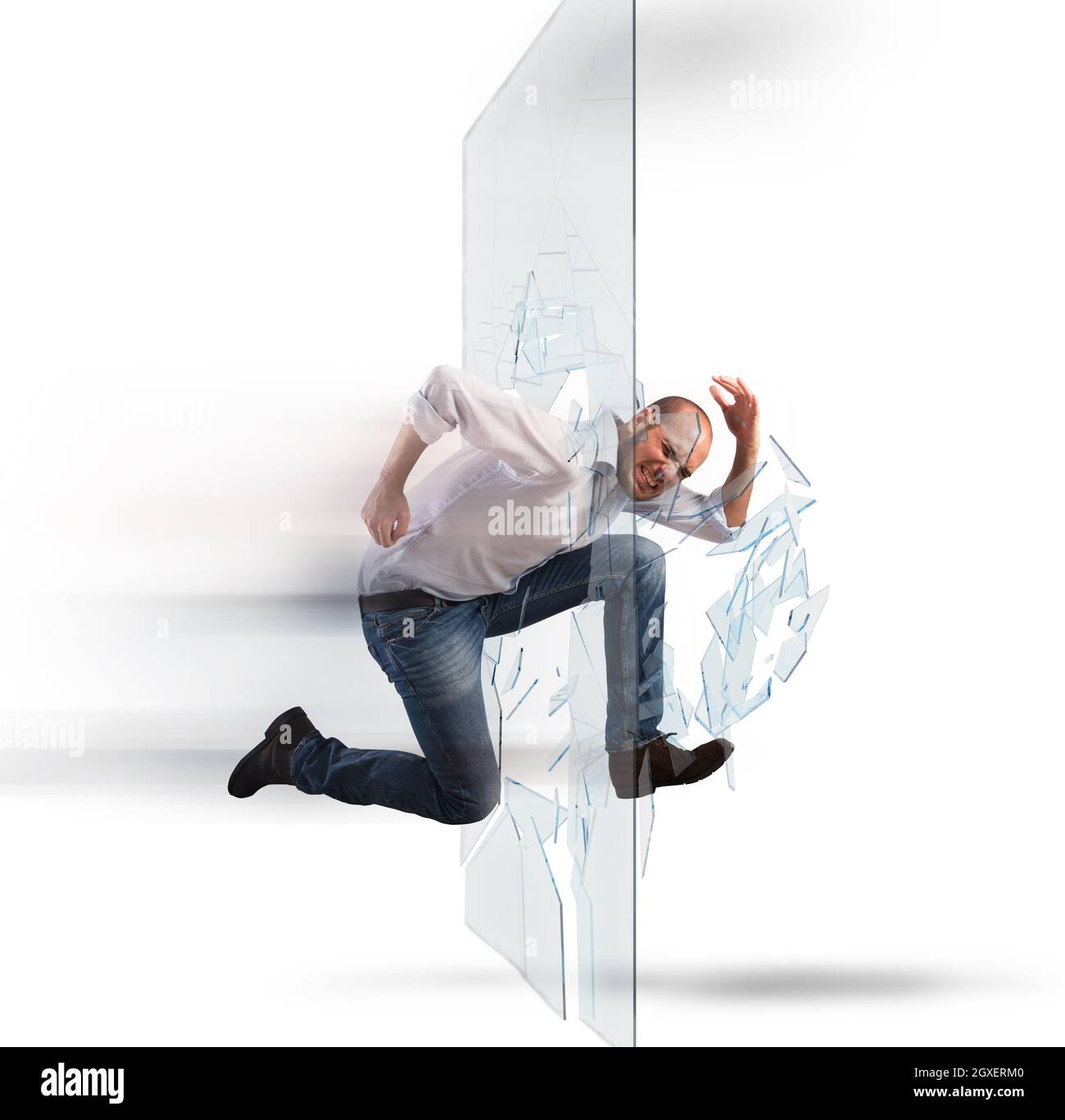 Determined businessman runs and breaking a glass Stock Photo - Alamy