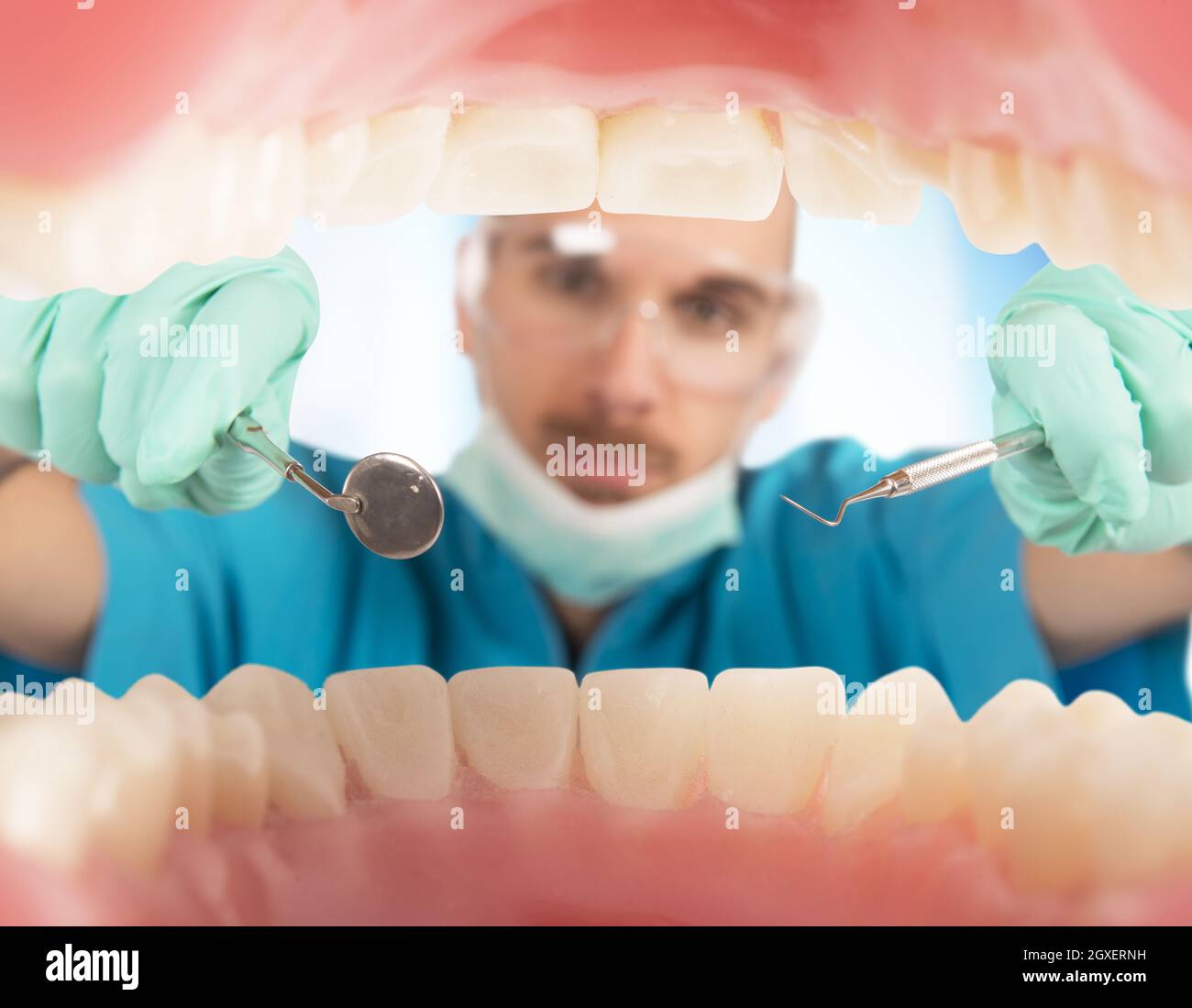 Dentist checks the teeth of a patient Stock Photo - Alamy