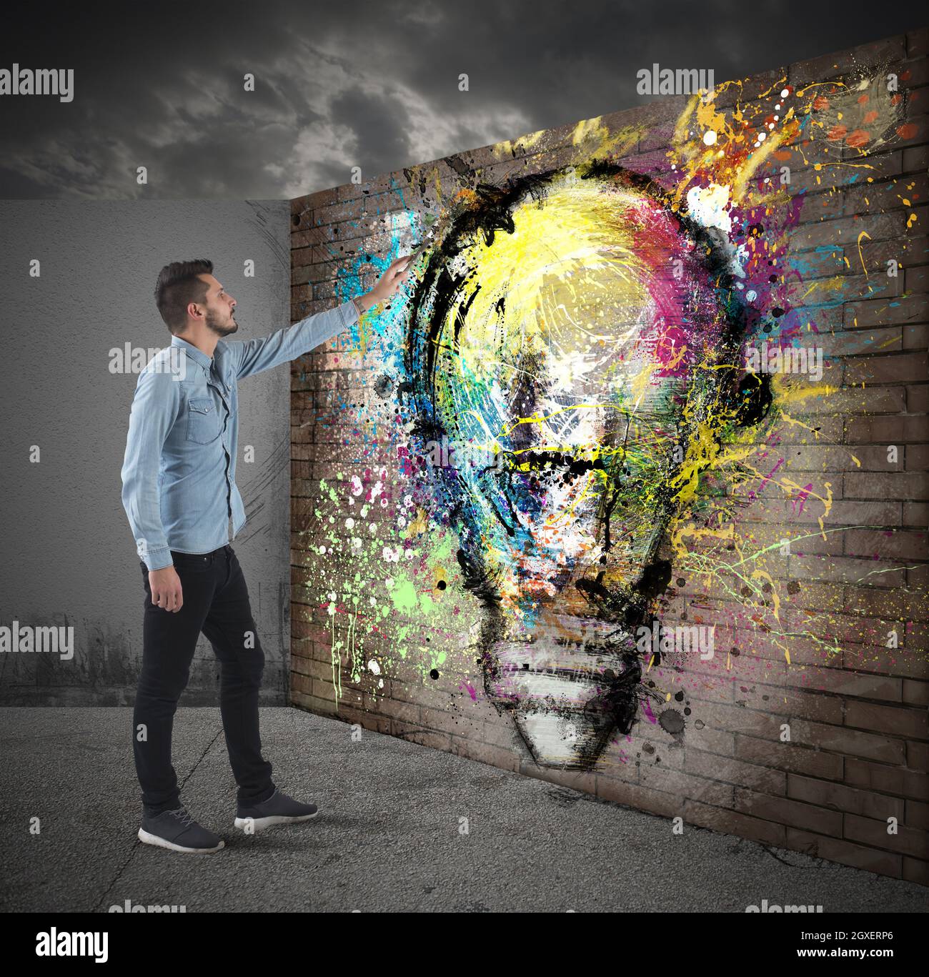 Boy draws a colored bulb on a wall Stock Photo - Alamy
