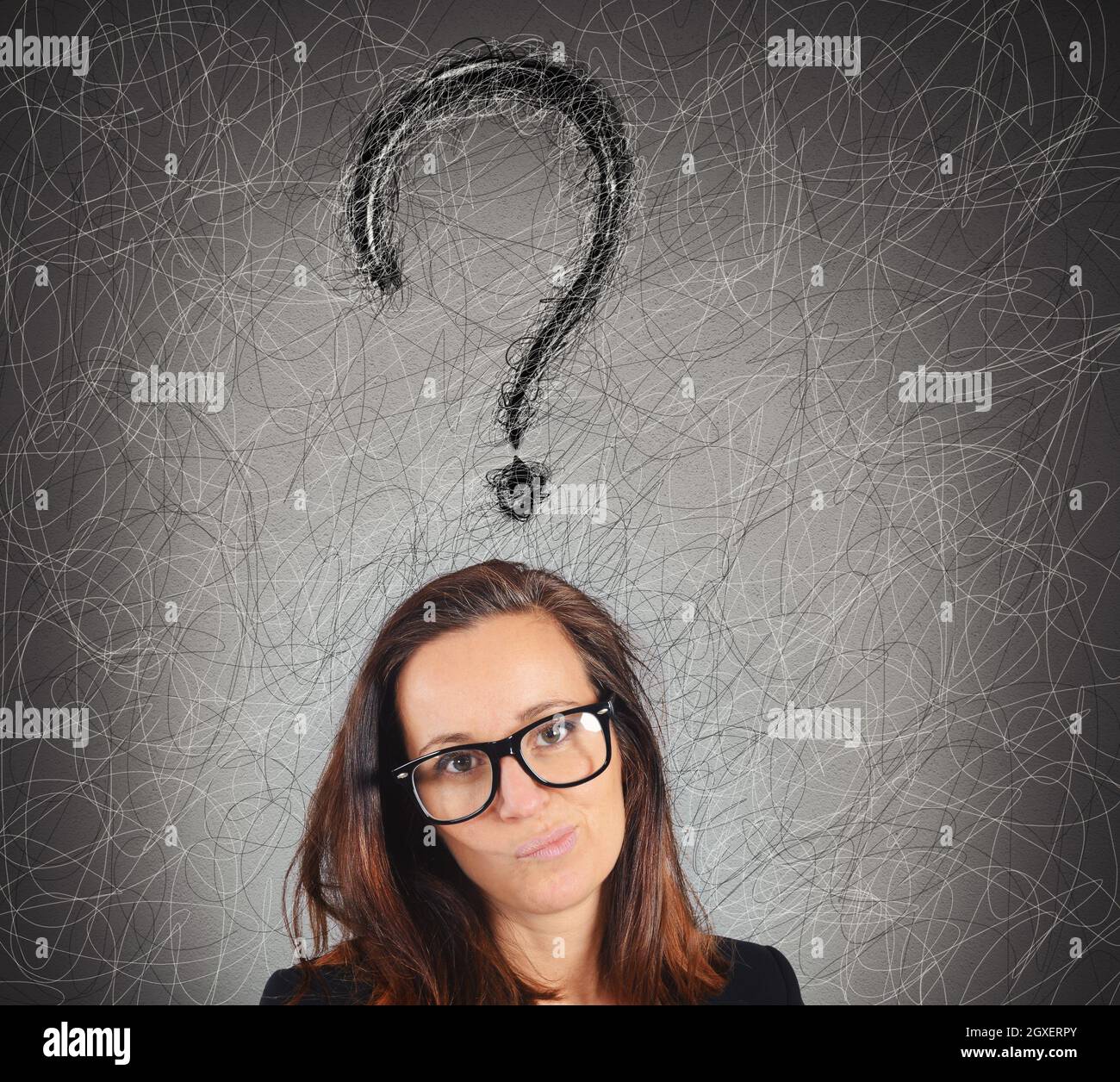 Businesswoman with big question mark over head Stock Photo - Alamy