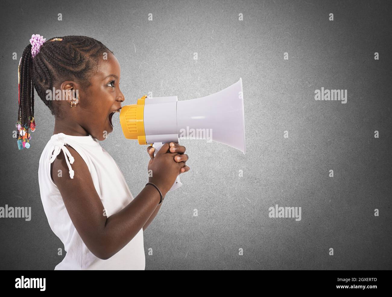 Little girl screaming and shouting with megaphone Stock Photo - Alamy