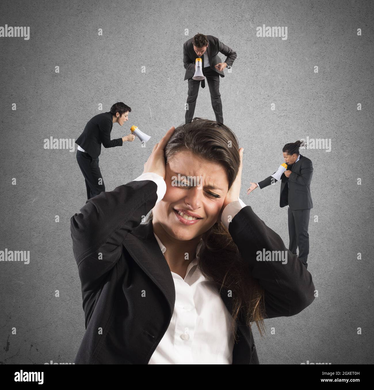Employees yelling to a businesswoman with megaphone Stock Photo - Alamy
