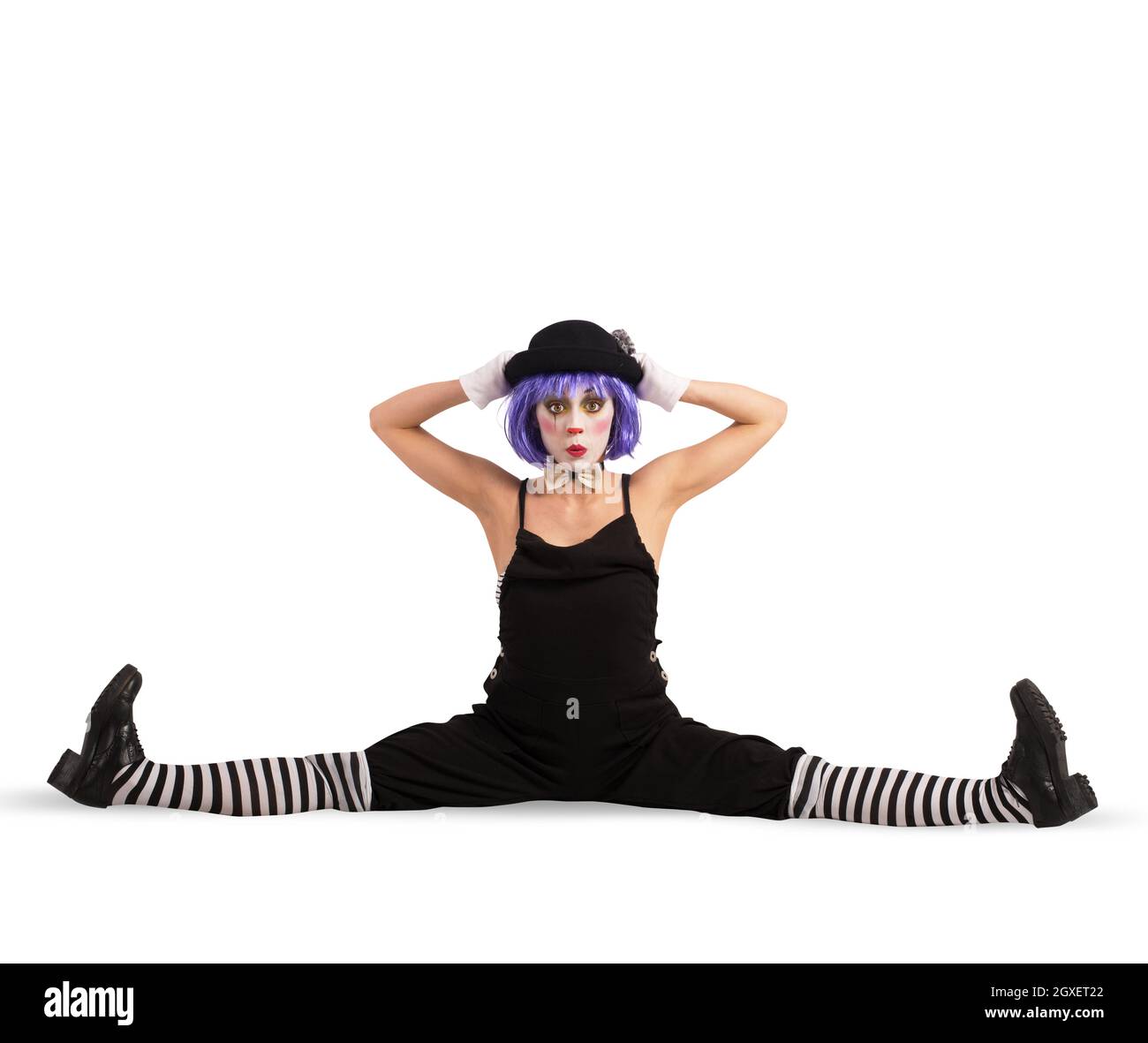 Funny clown dancer makes a big split Stock Photo - Alamy