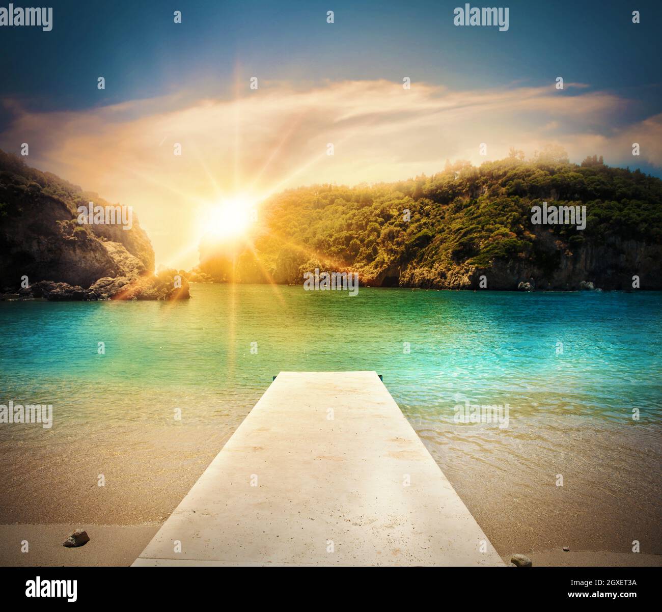 Background jetty on the beach between mountains Stock Photo - Alamy